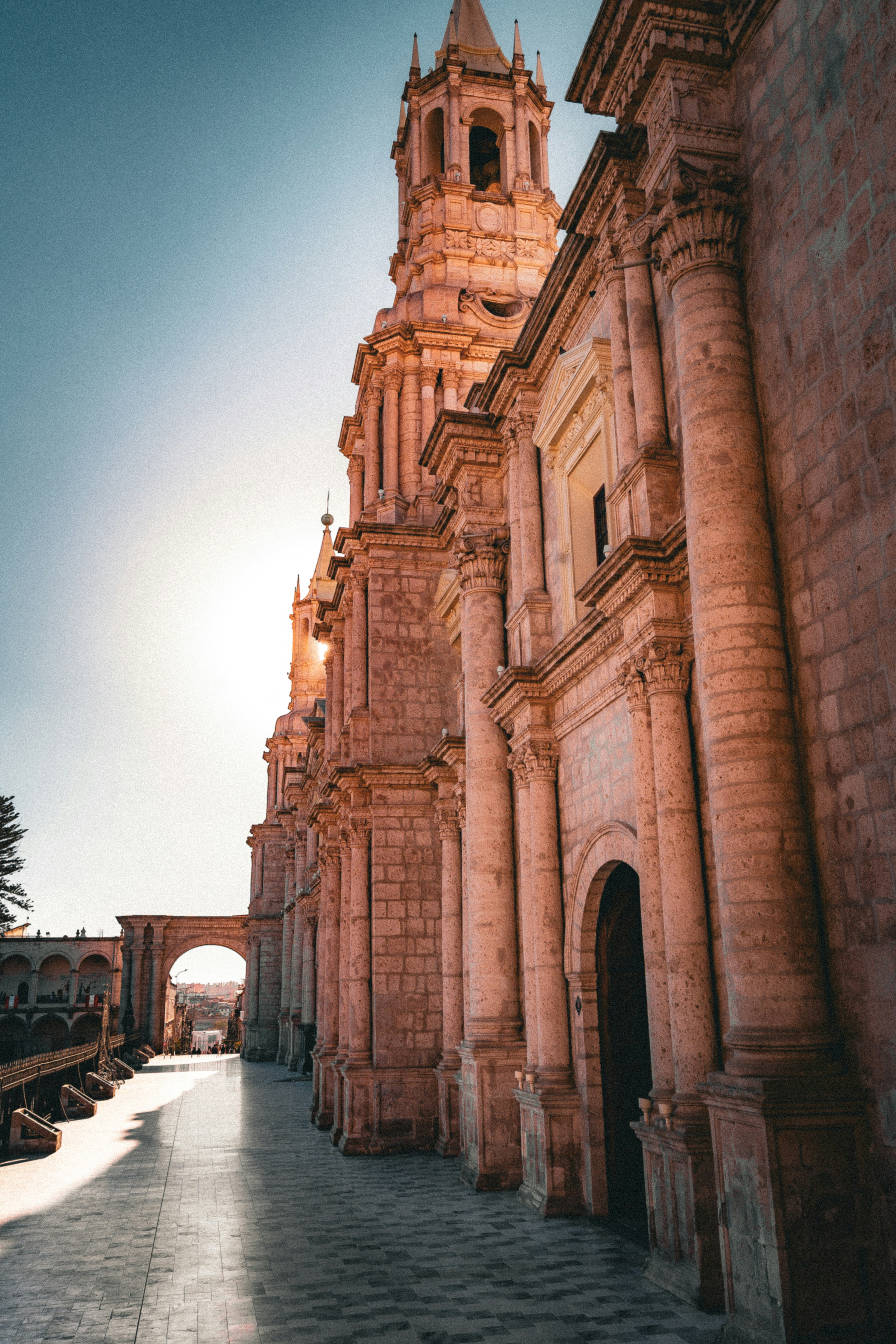 Stone Cathedral Rising beside a Shaded Colonnade