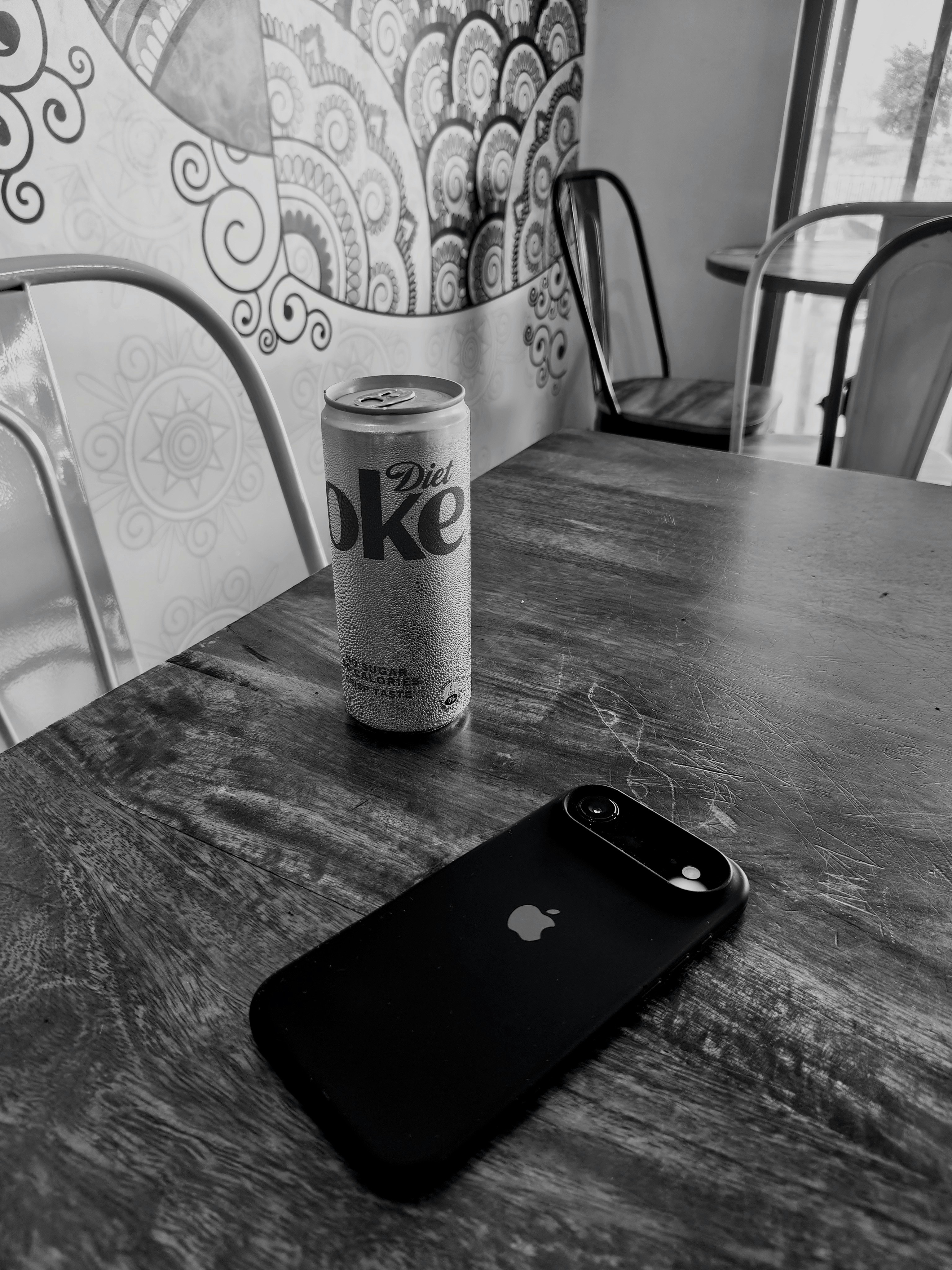 Midday Pause: Soda Can and iPhone on a Soiled Table