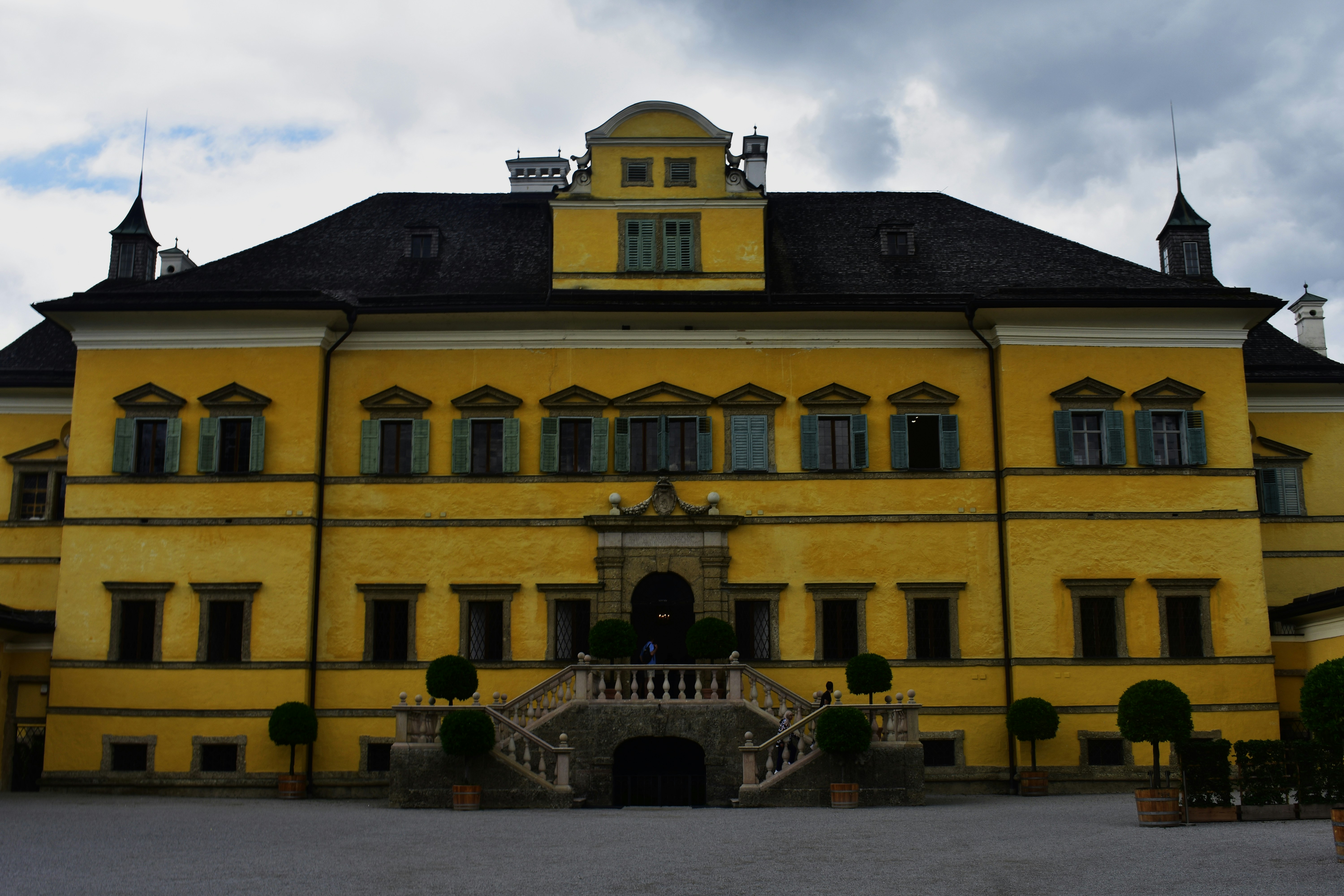 Yellow Baroque Manor: Symmetry, Steps, and Weathered Grandeur