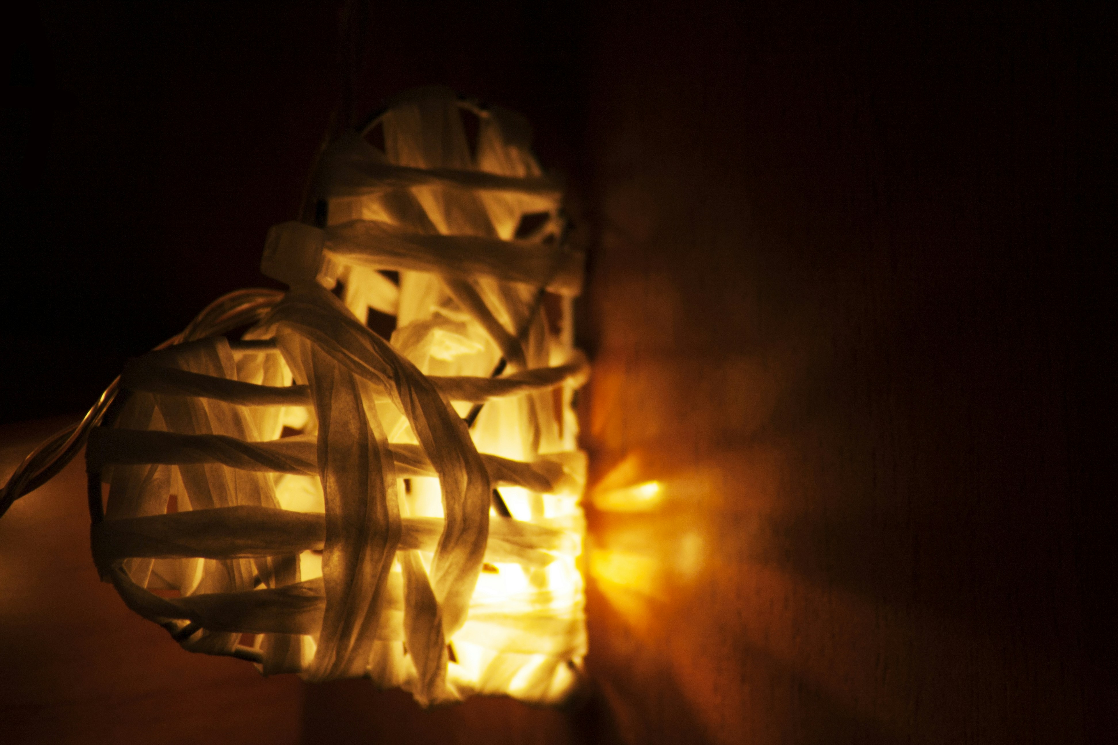 Warm Cones of Light: a Wrapped Lamp Casting Shadows
