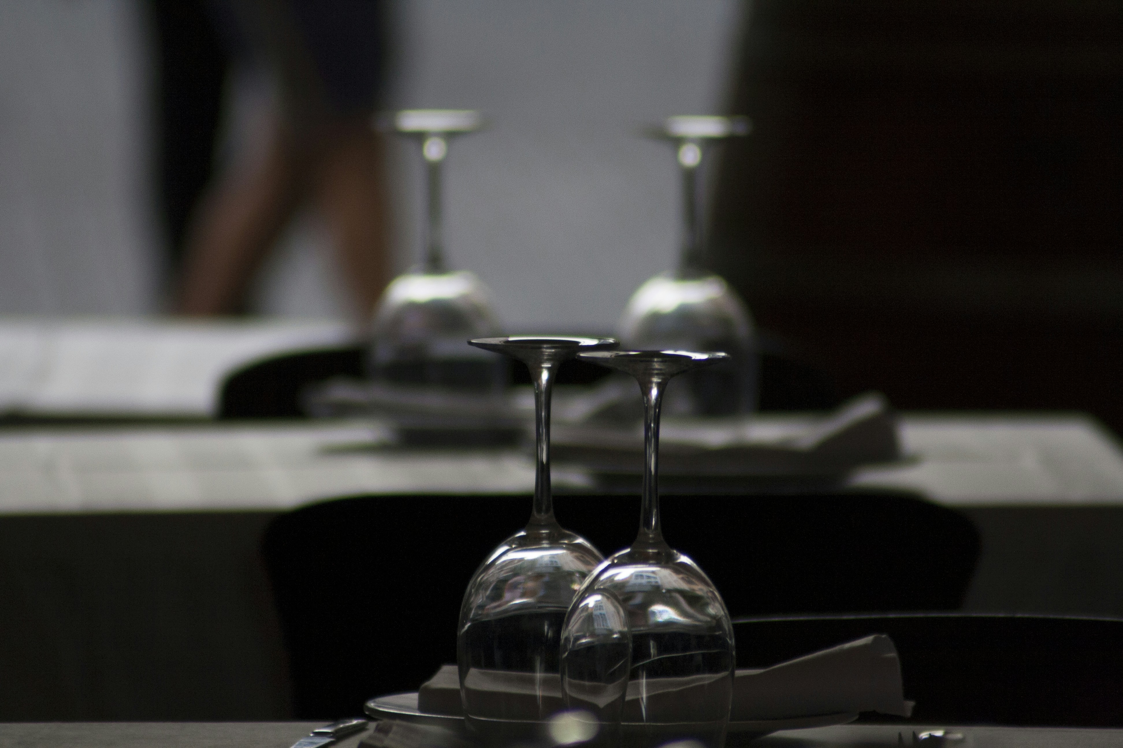 Upside-down Glasses: A Quiet Table in Focus
