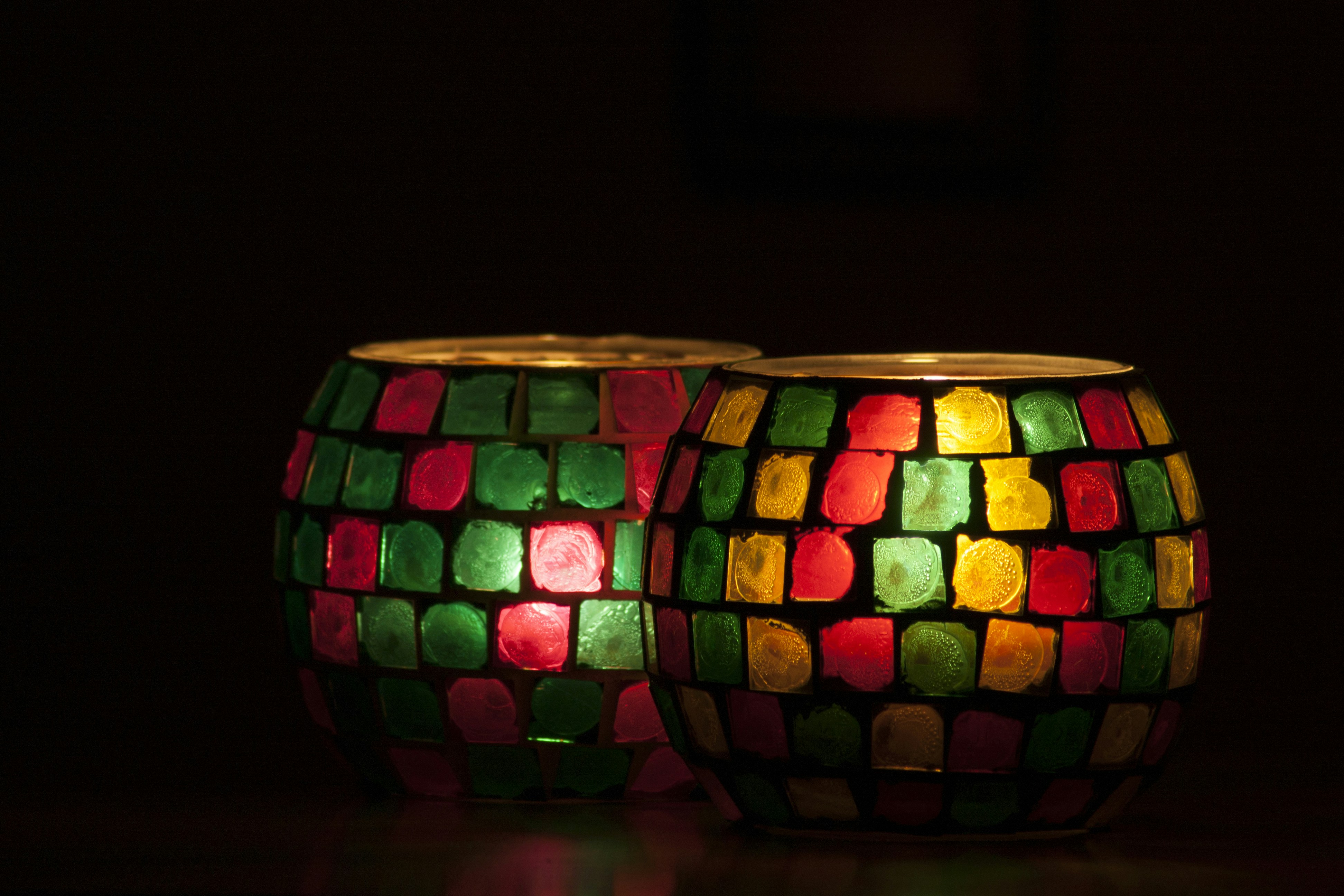 Colorful Mosaic Candles in Dim Glow
