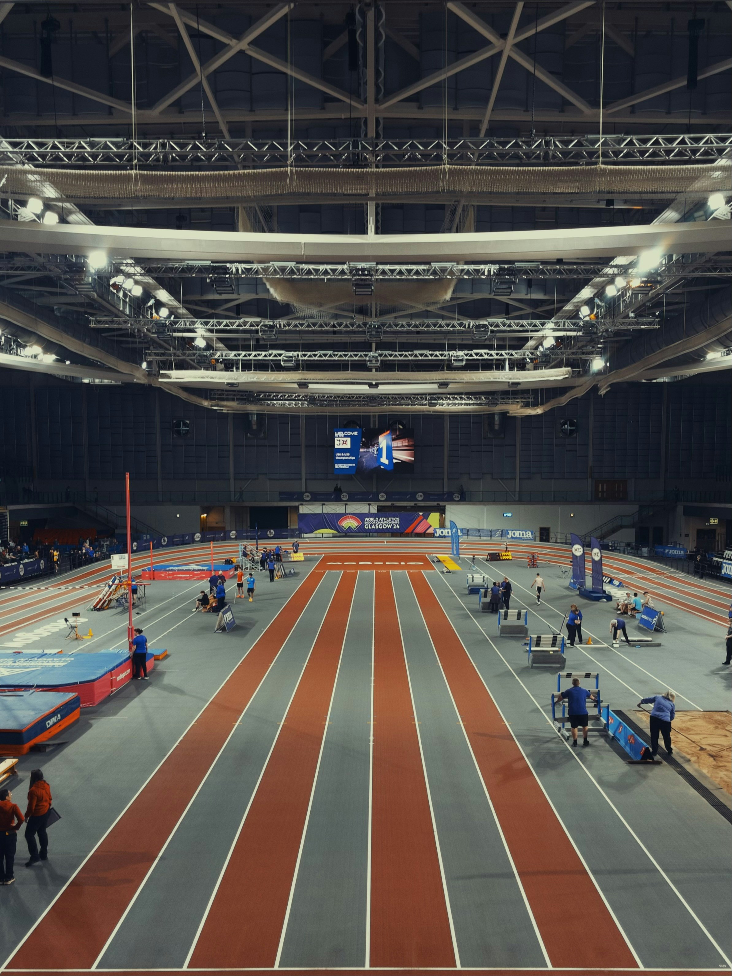 Indoor Trackyard: Parallel Lanes Recede Toward a Digital Wall