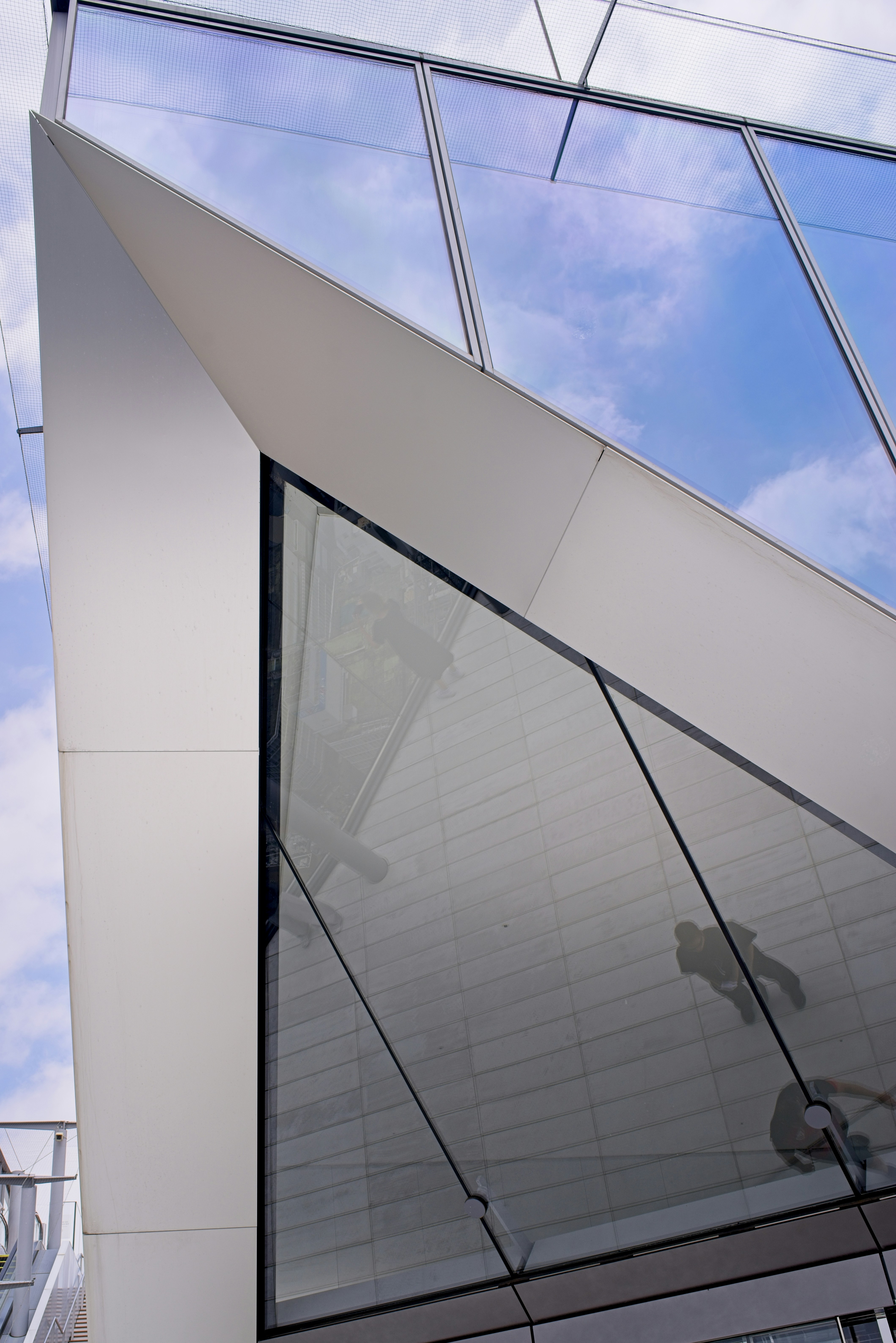 Architectural Prism: Glass Facade Fractals Reflected in Steel