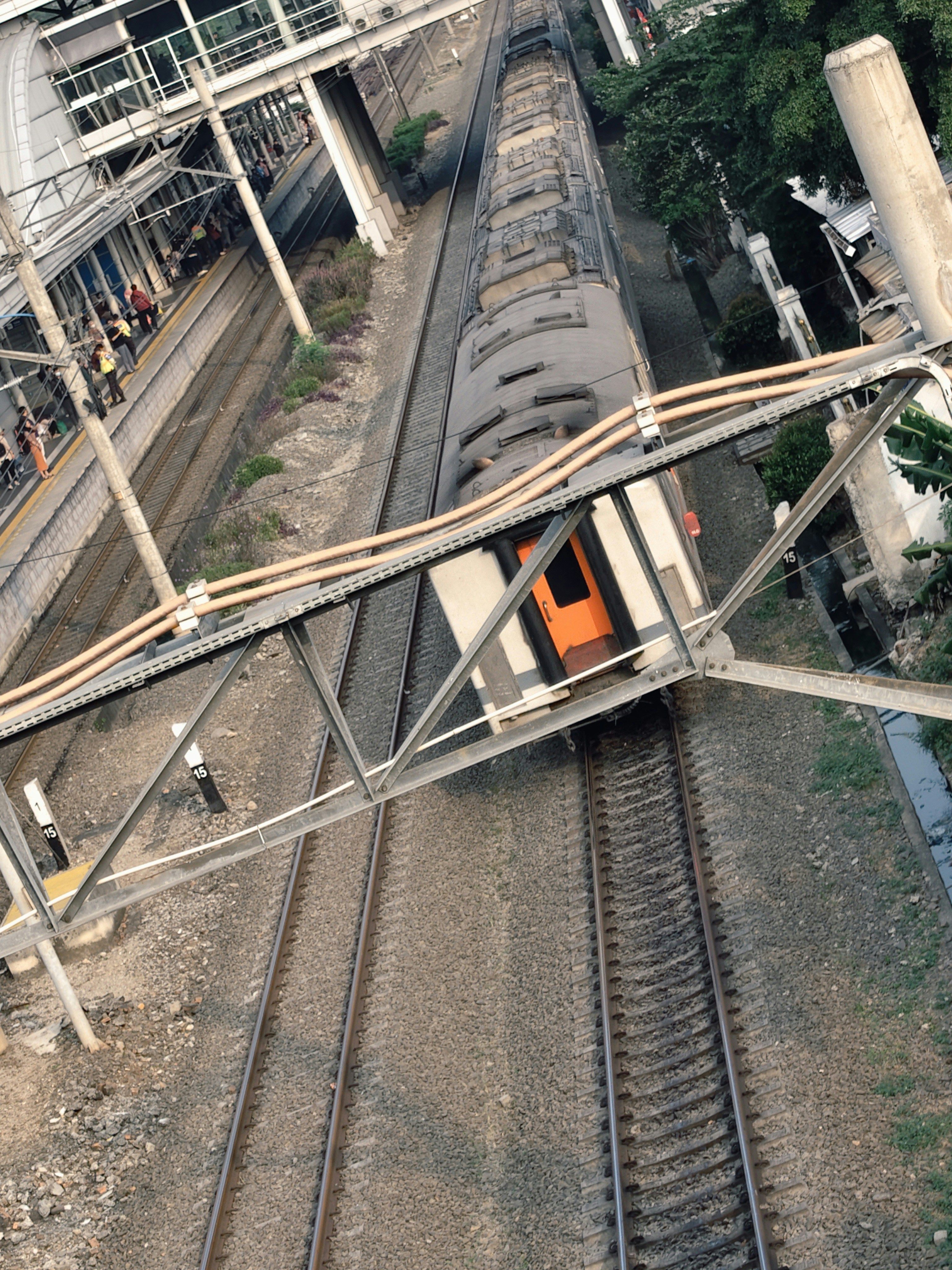 Overhead Corridor: A Train Tunnels Through a City Scene