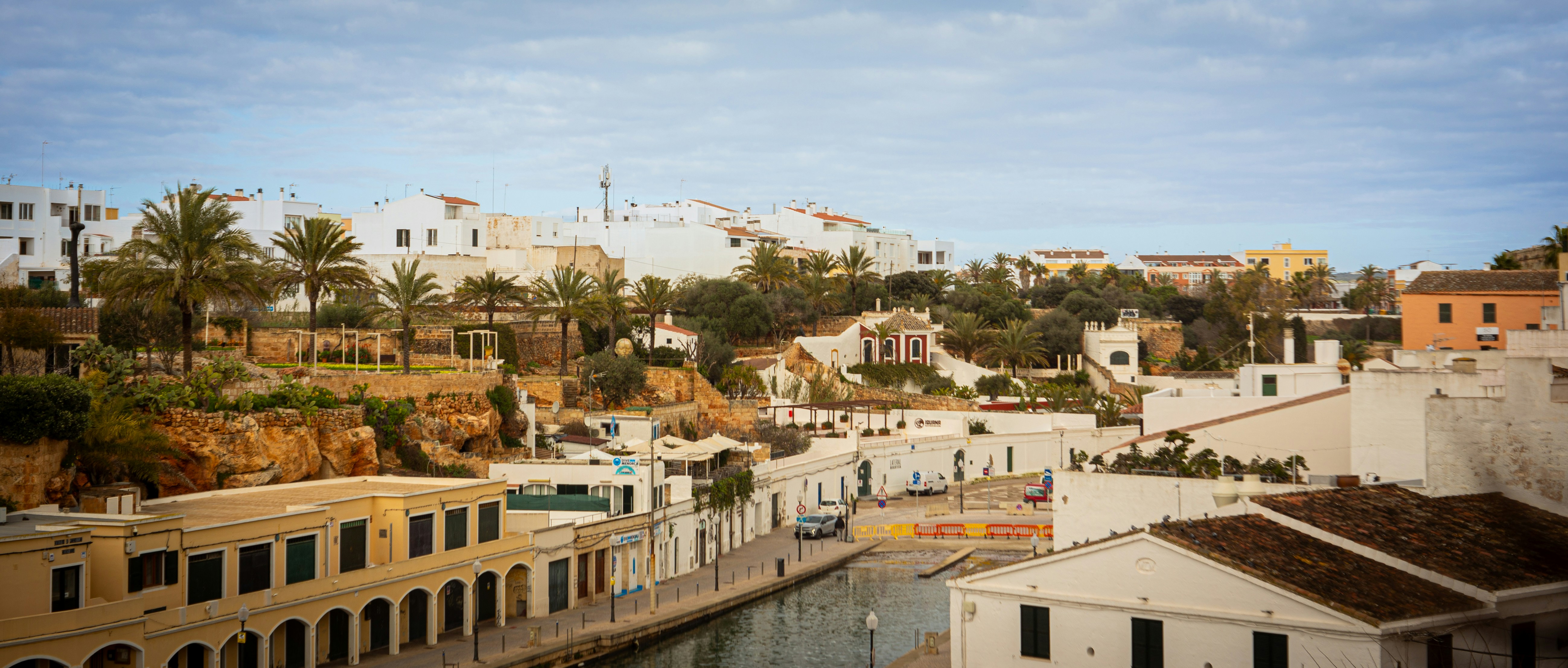 Harbor Crescent: Whitewashed Homes Rest Above a Quiet Mooring