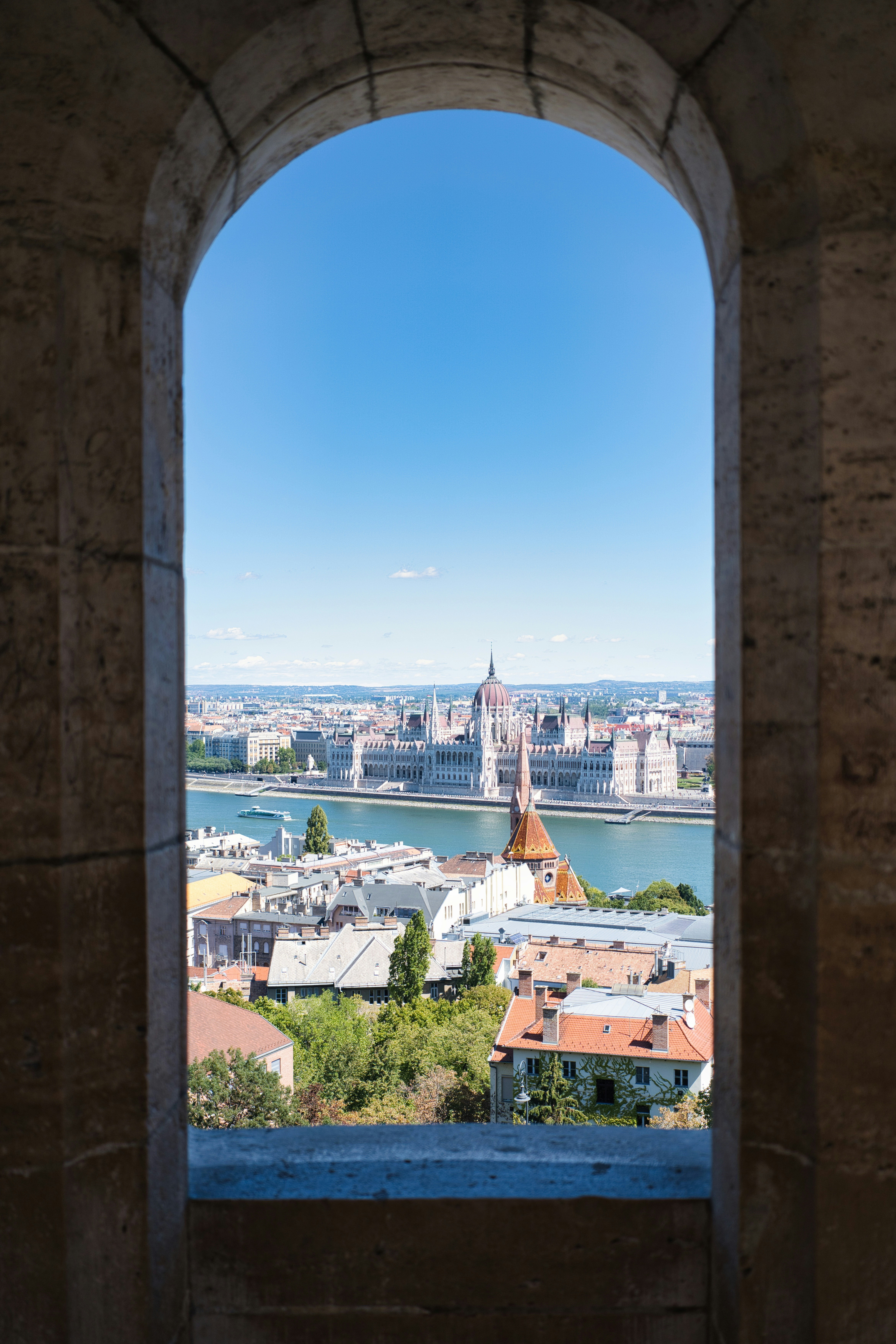View through the Arch: Budapest Parliament Over the Danube