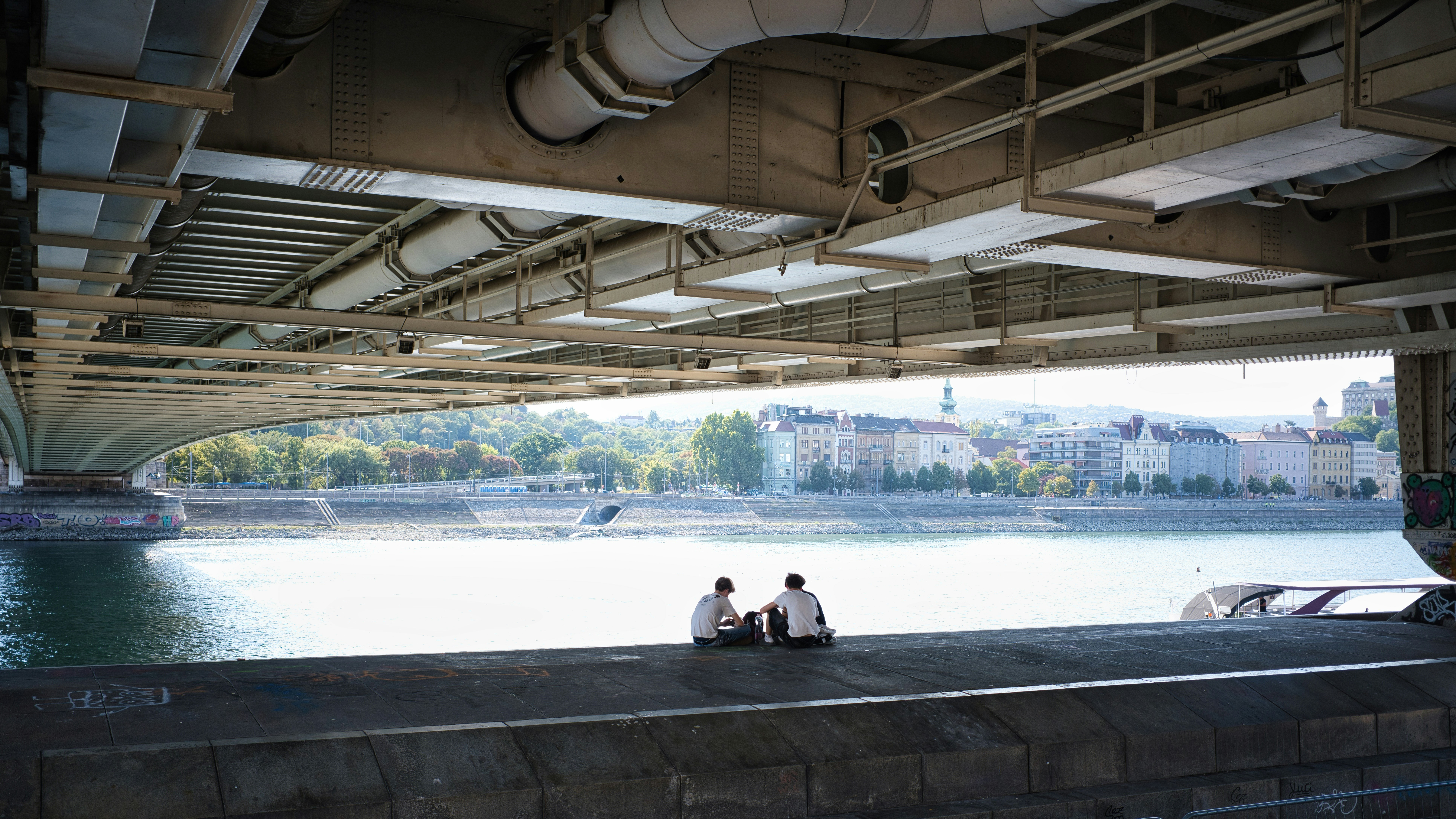 Quiet Reflection Under the Bridge: A Riverside Moment