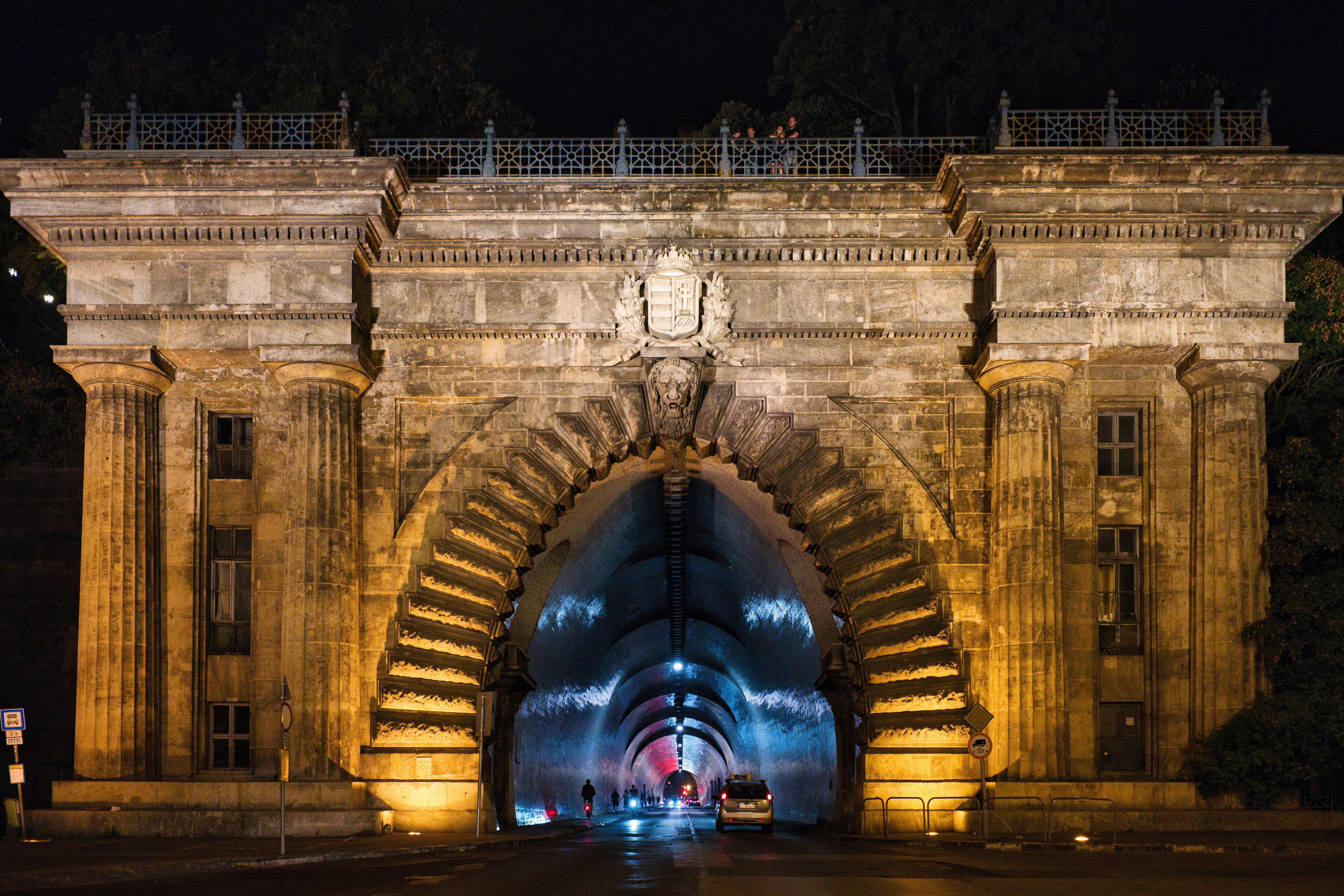 Light-arched Gateway: Night Tunnel Through a Historic Archway