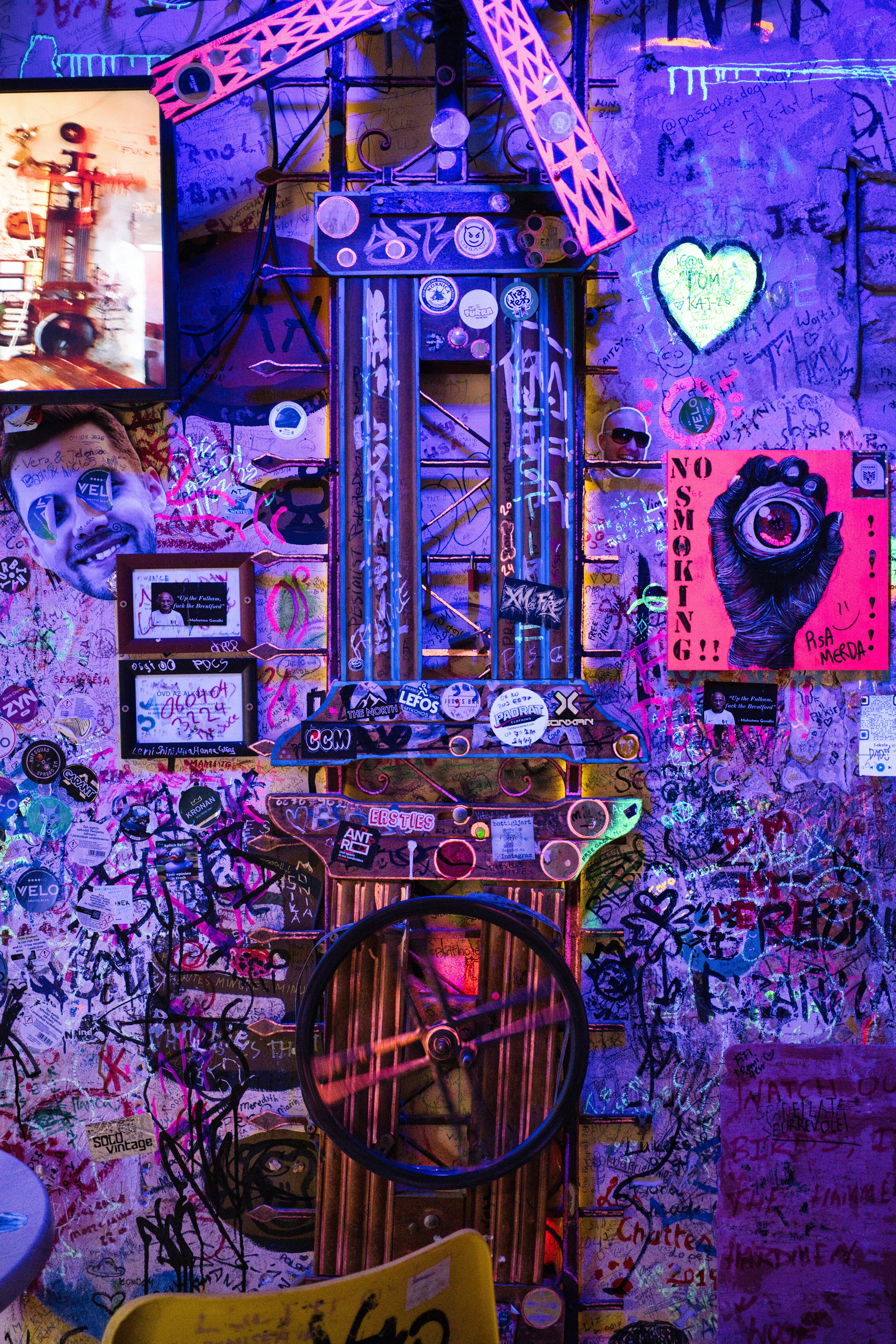 Graffiti-Covered Workshop with a Gyro Wheel and Neon Palette