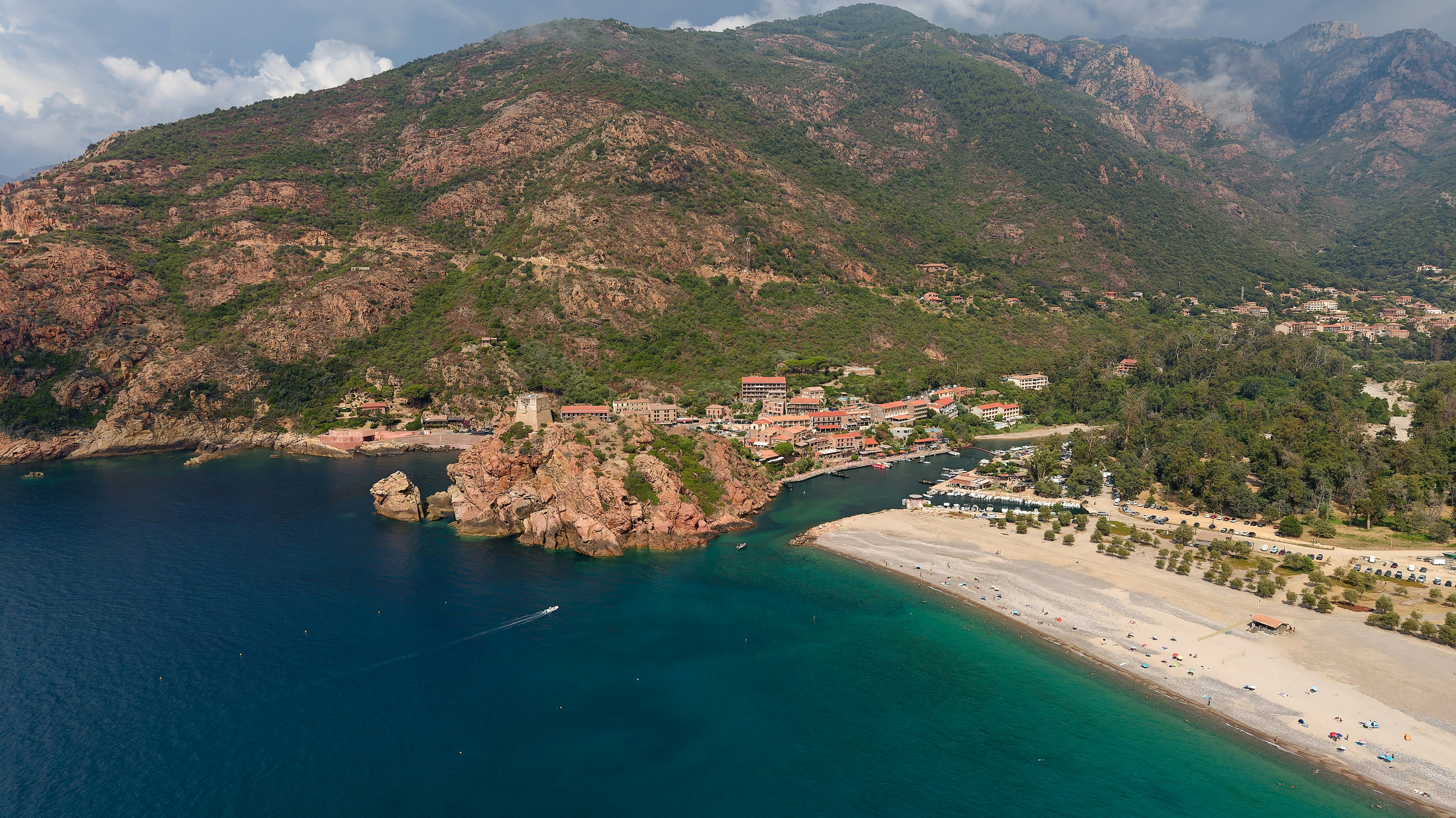 Coastal Village Framed by Rugged Hills