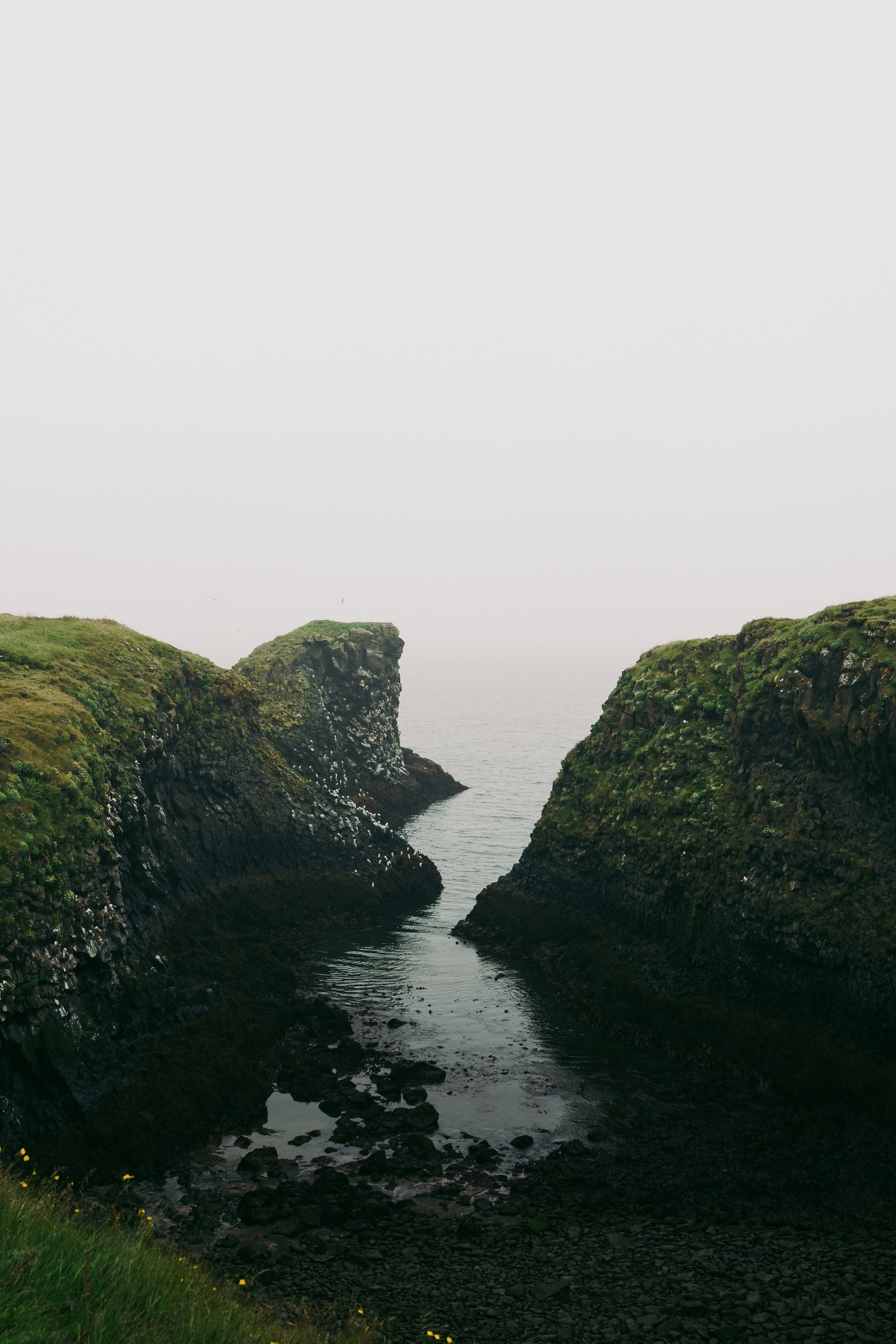 Cliffside Passage Between Quiet Green Bays