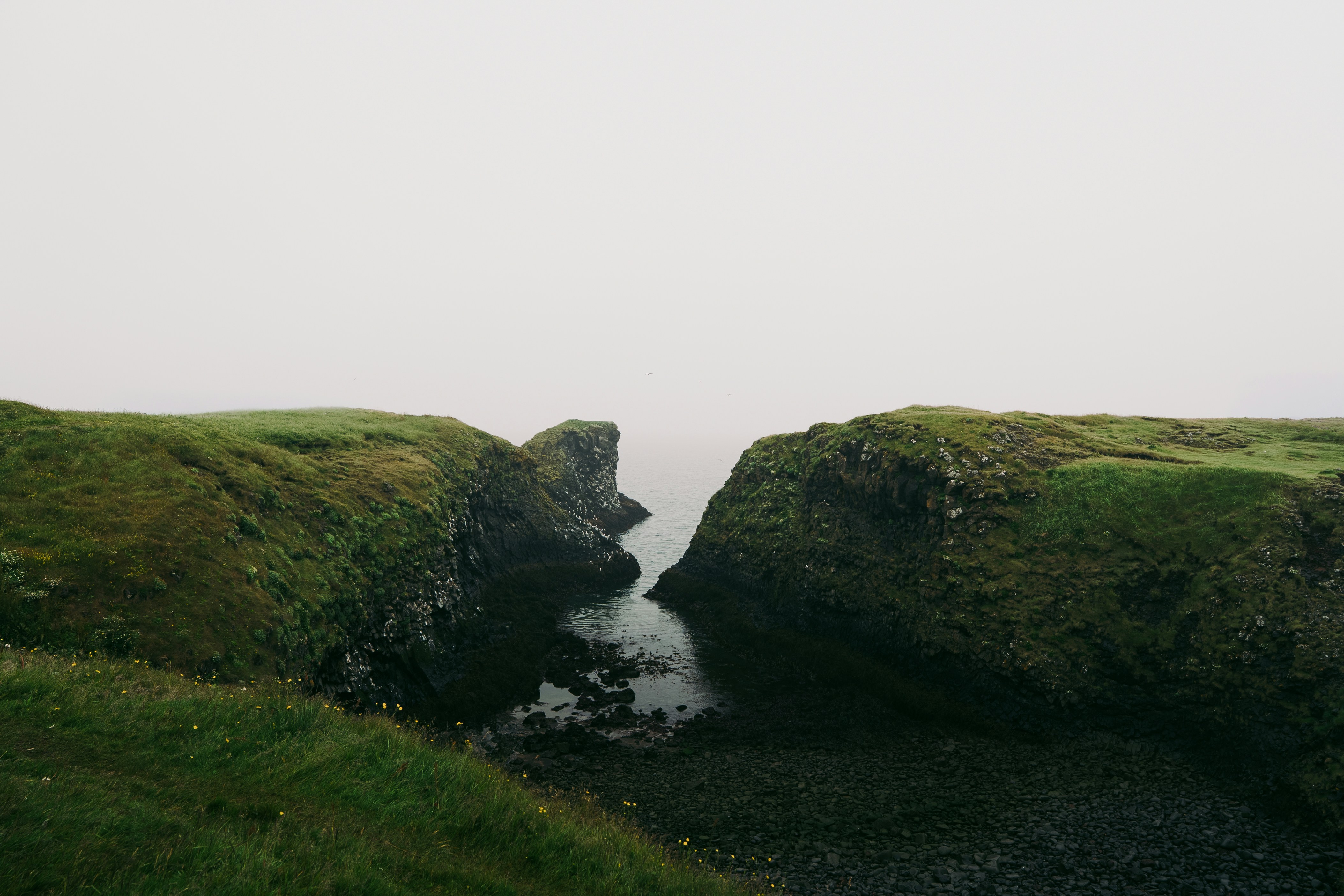 Cove Gap Between Emerald Cliffs Under Quiet Dawn