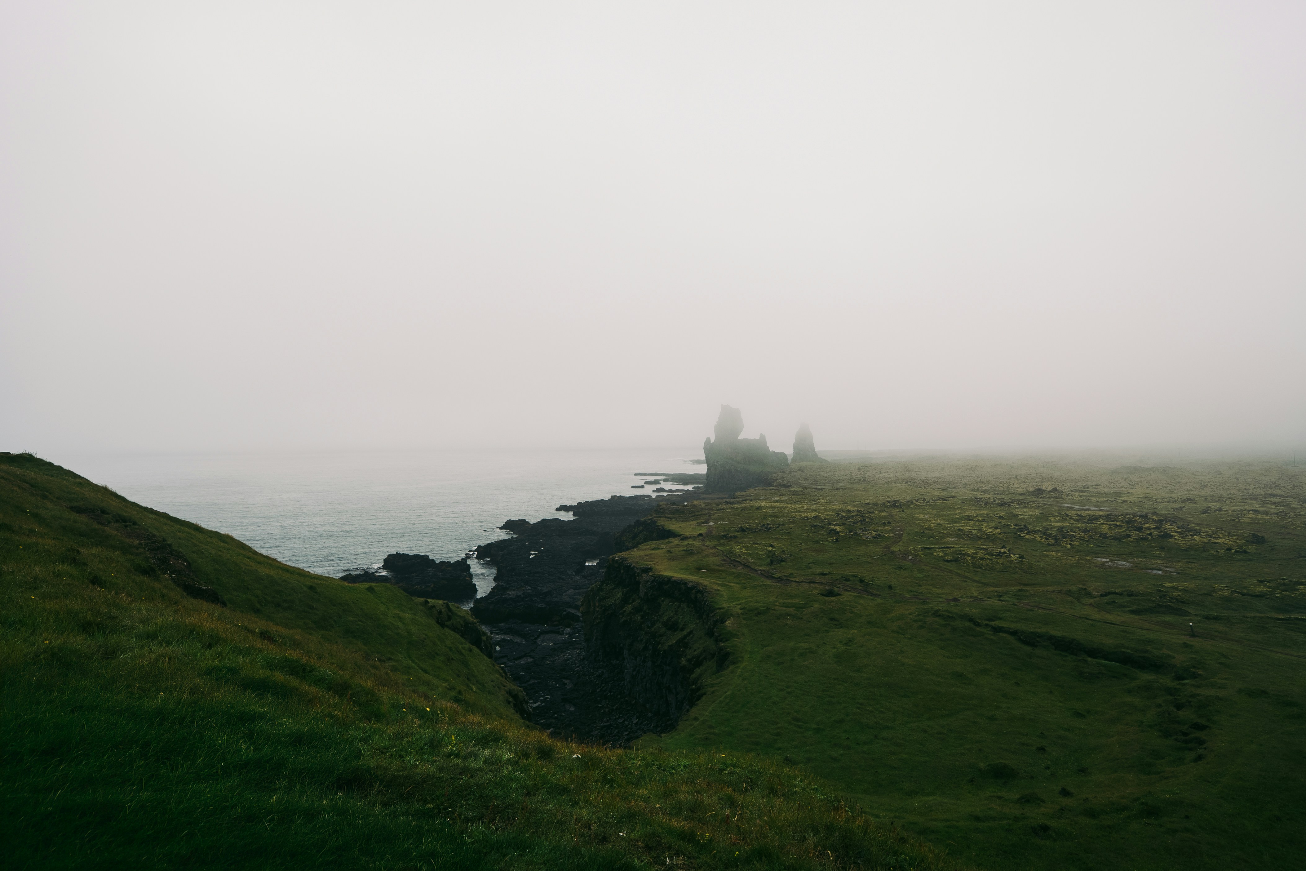 Misty Headland: Courageous Cliffs Beneath an Empty Sky