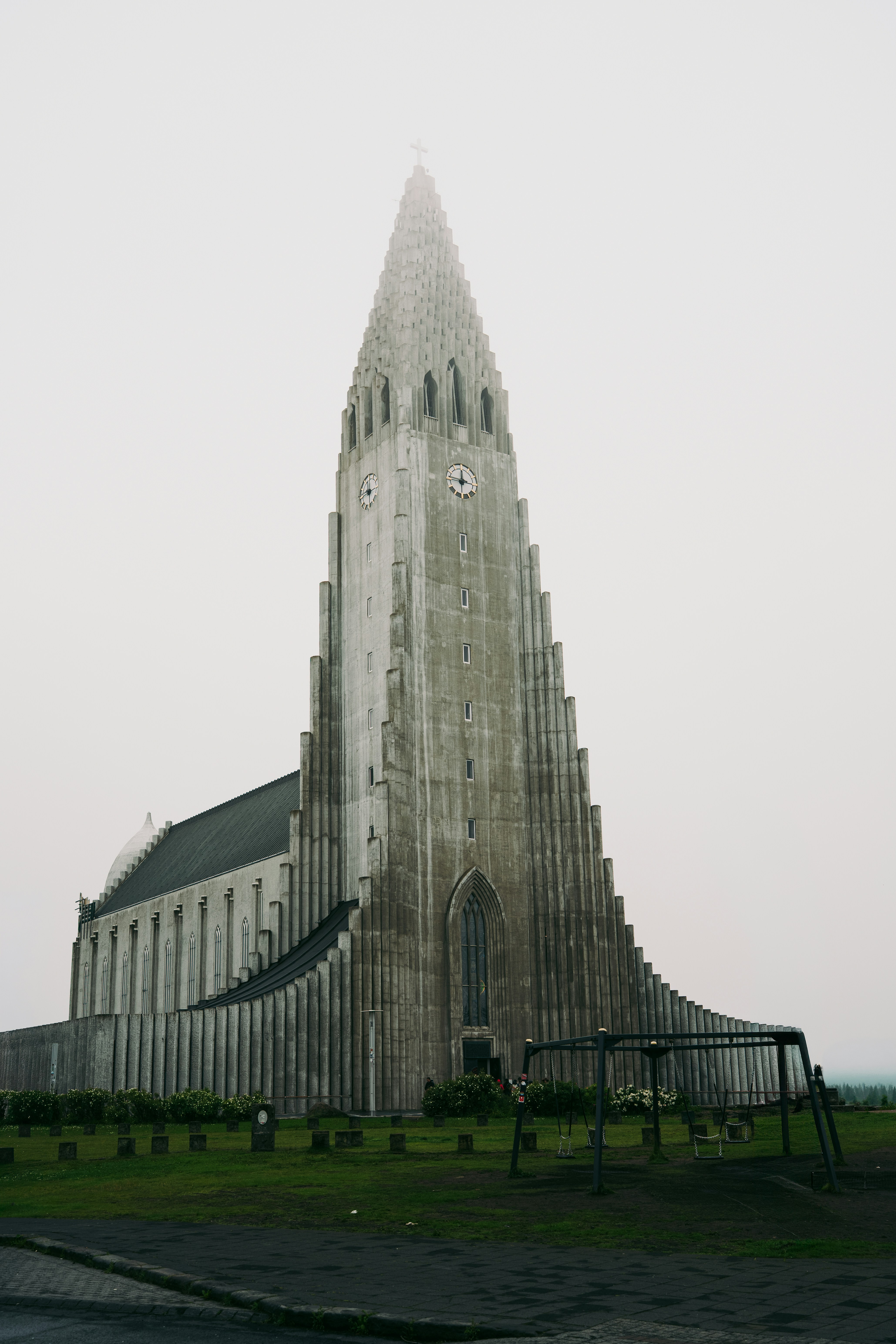 Towering Silence: A Gothic Spire Reaching Toward a Misty Sky