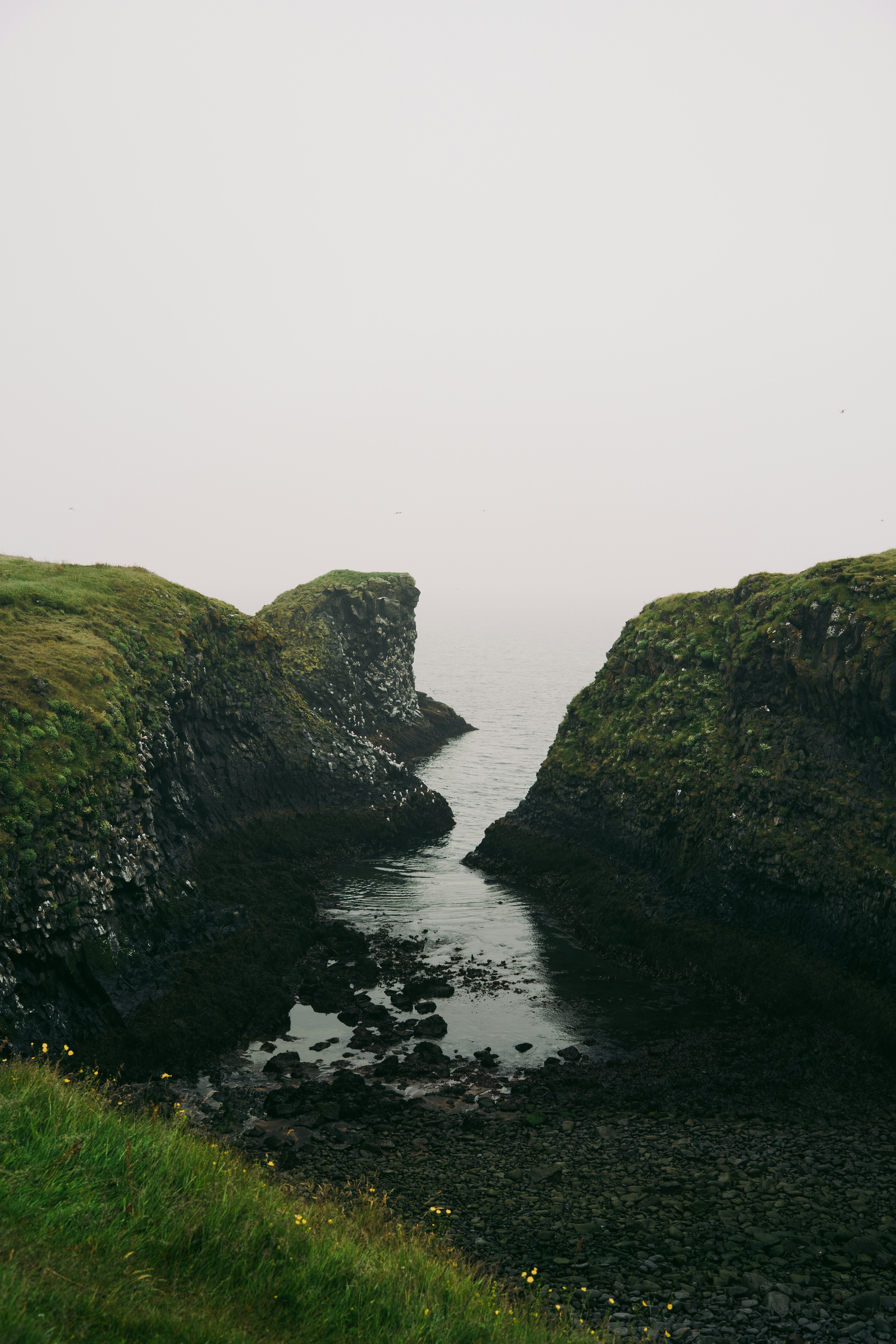 Cliffside Passage Toward the Misty Sea