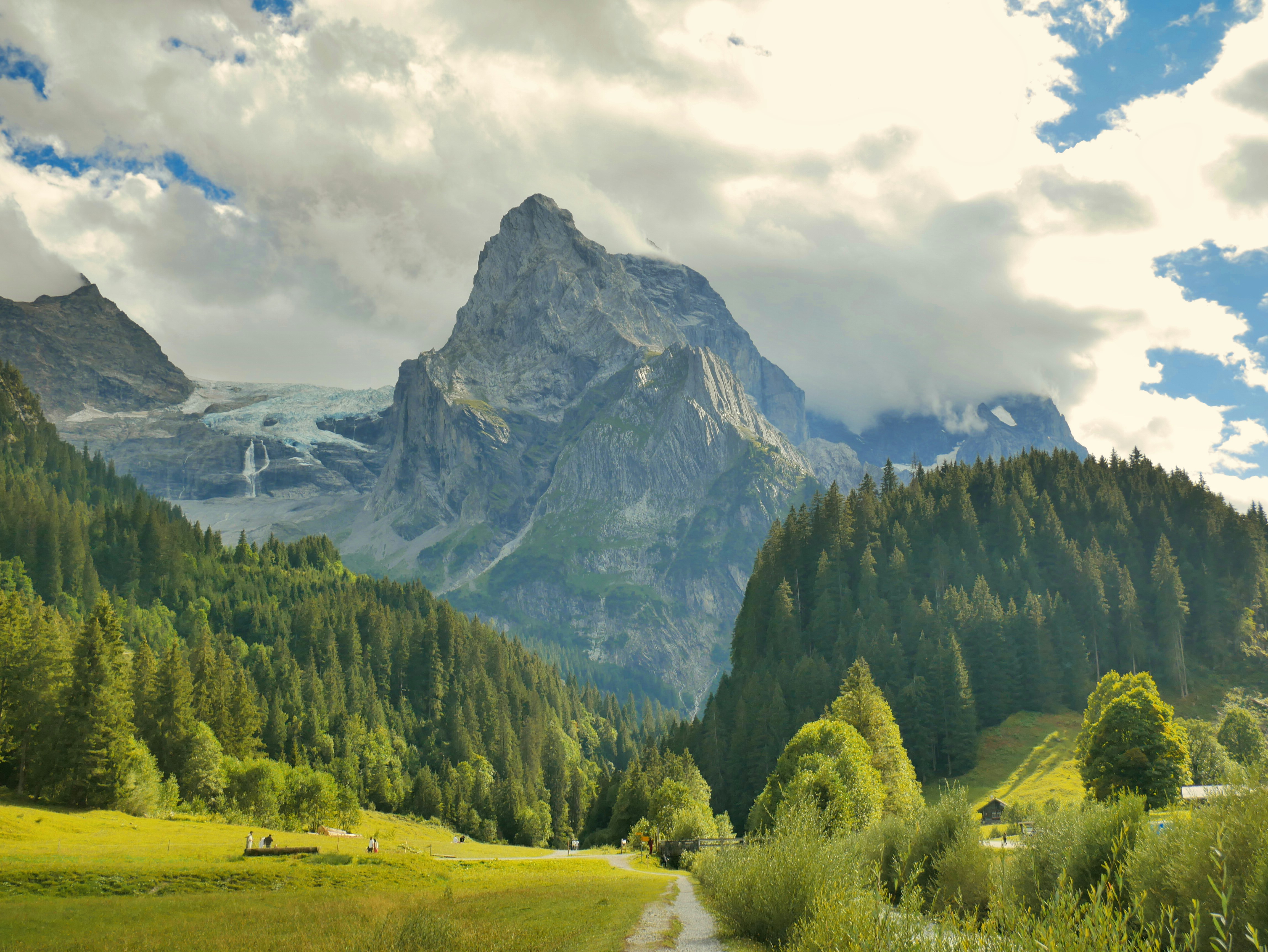 Majestic Alpine Peak Over a Lush Valley