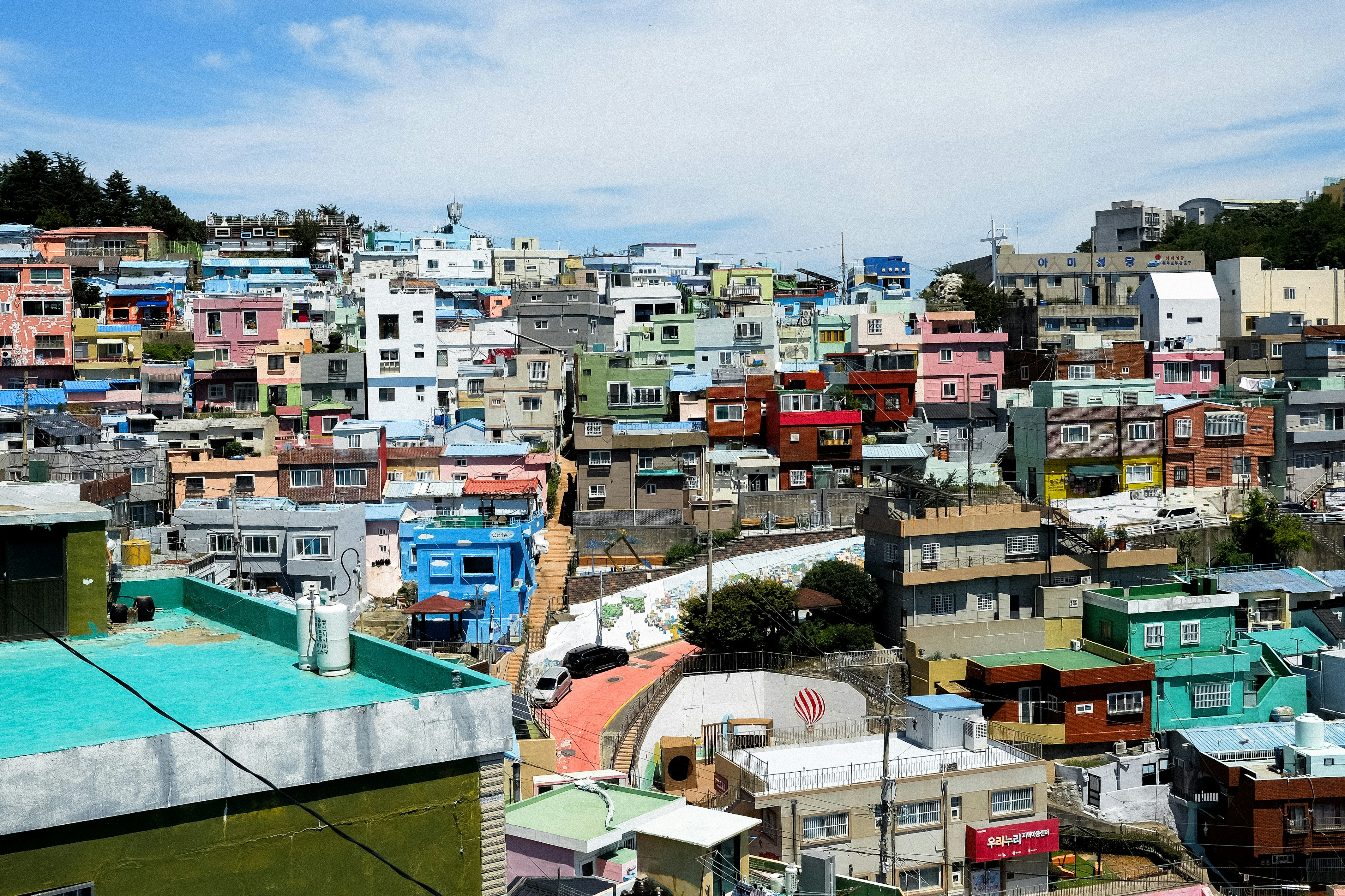 Vibrant hillside maze: a living mosaic of pastel rooftops