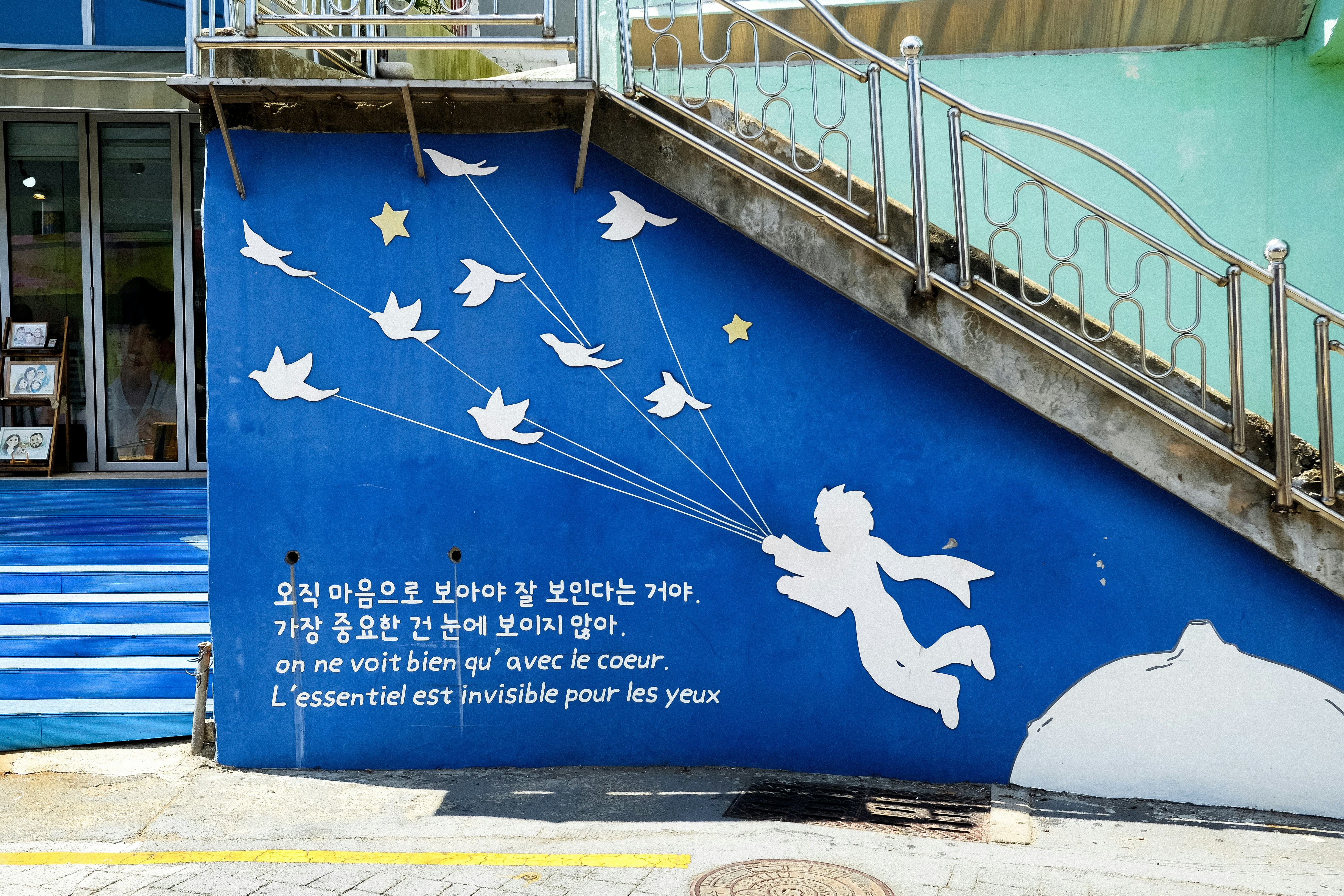Blue Wall Chorus: A Kite of Doves Soars Across a Staircase