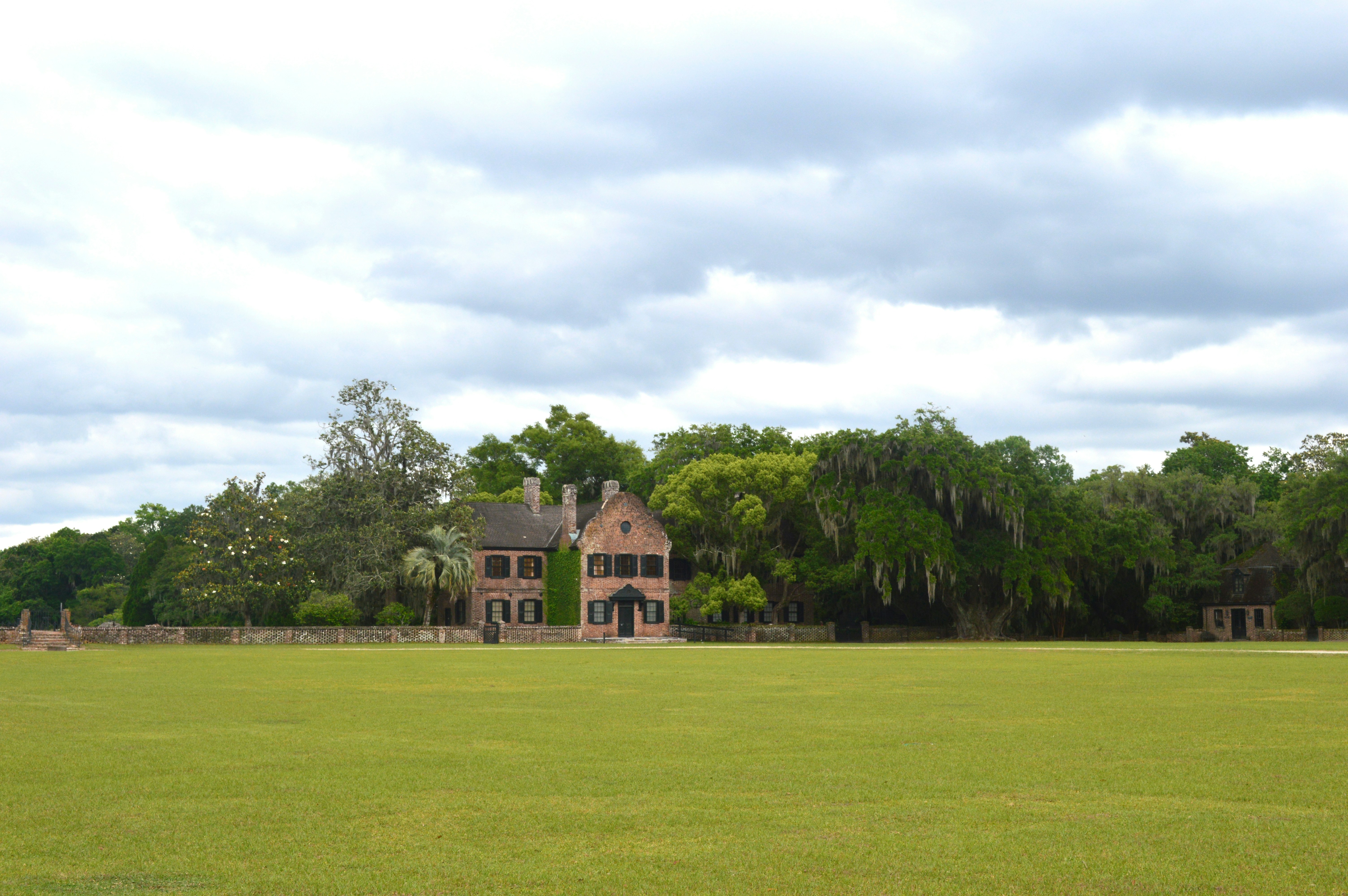 Sunlit Estate Across a Expansive Lawn