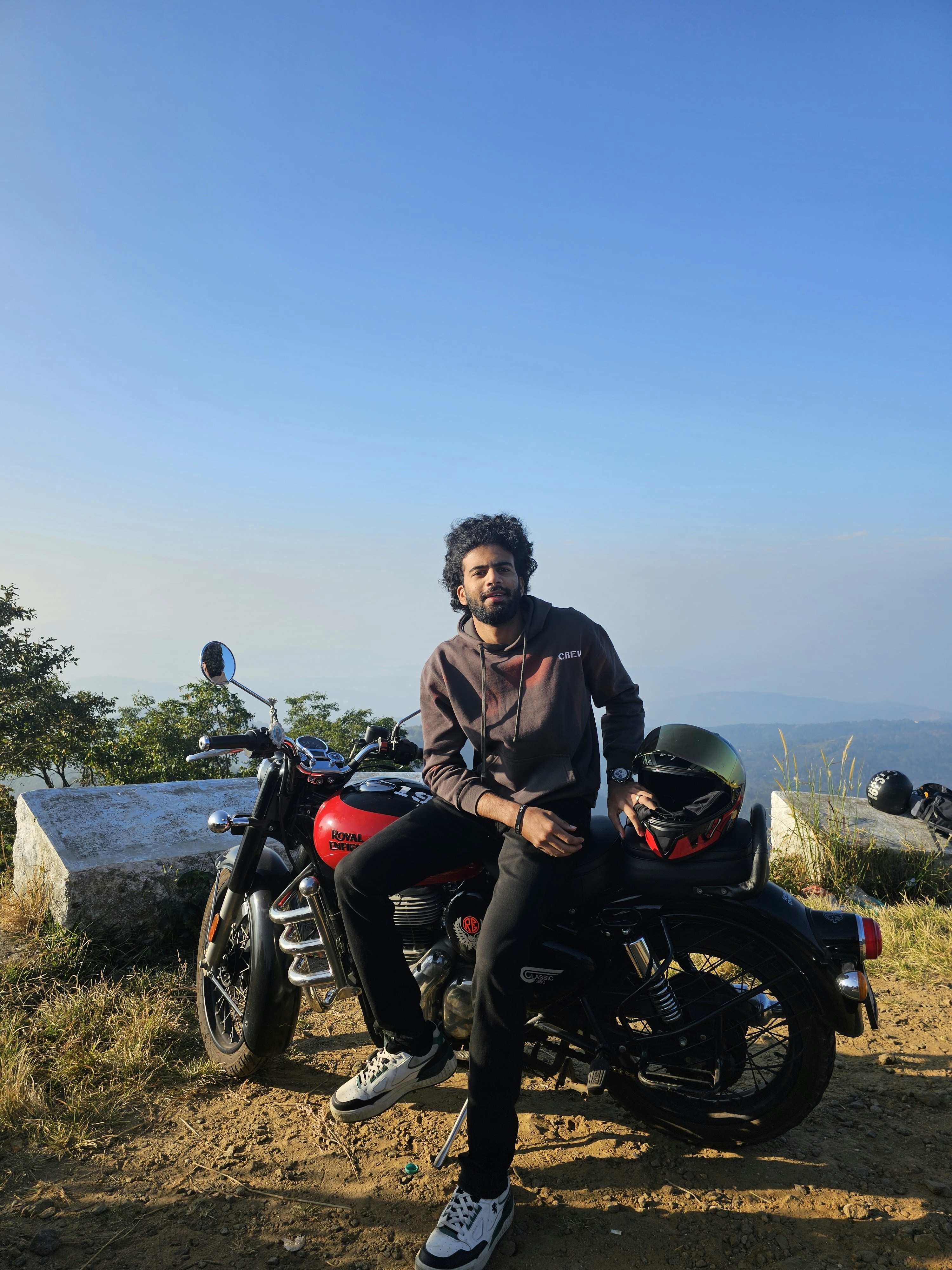 Rider at the Edge: Portrait by the Mountain Roadside