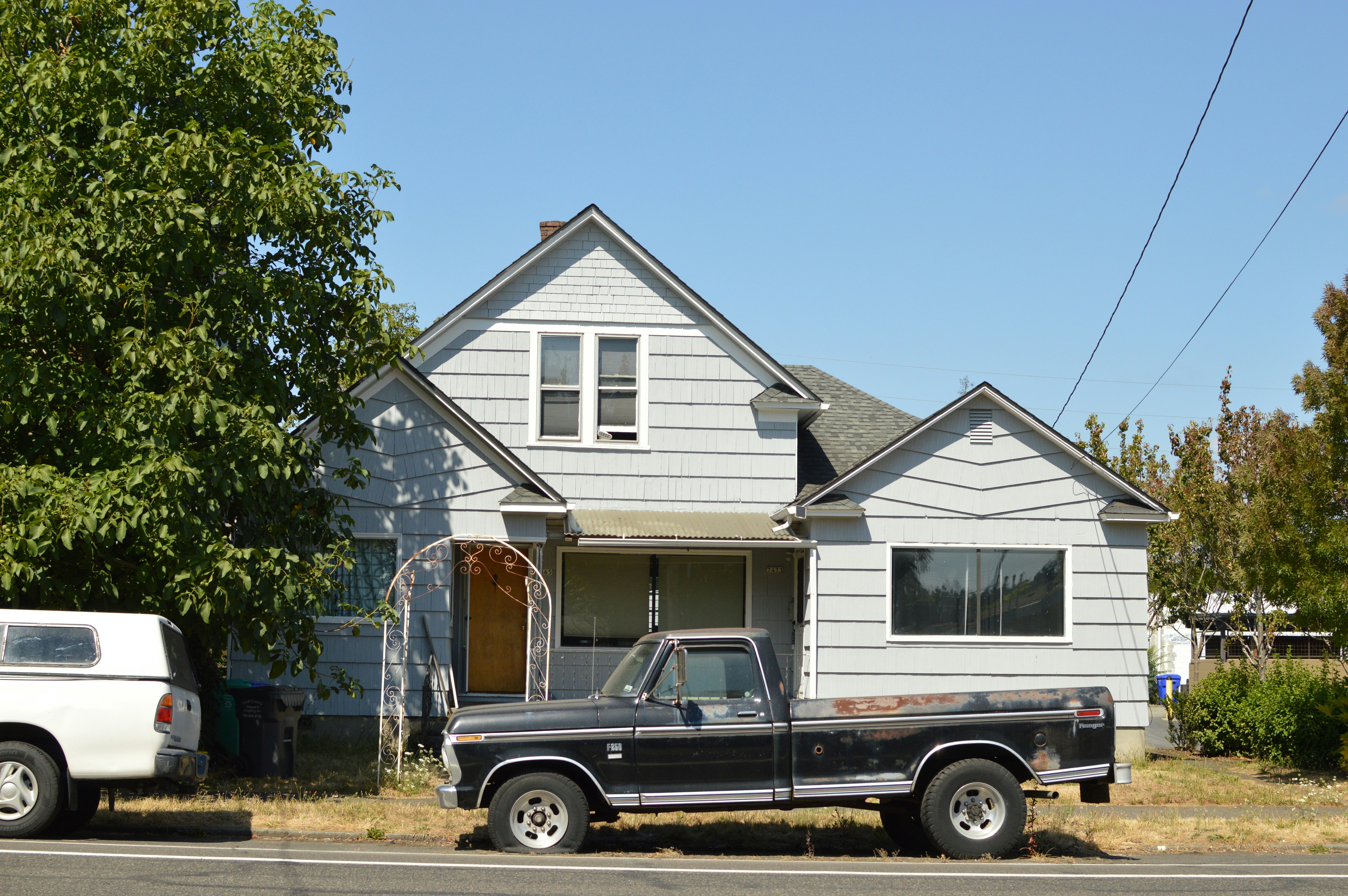 Old Pickup in Front of a Quiet Suburban House