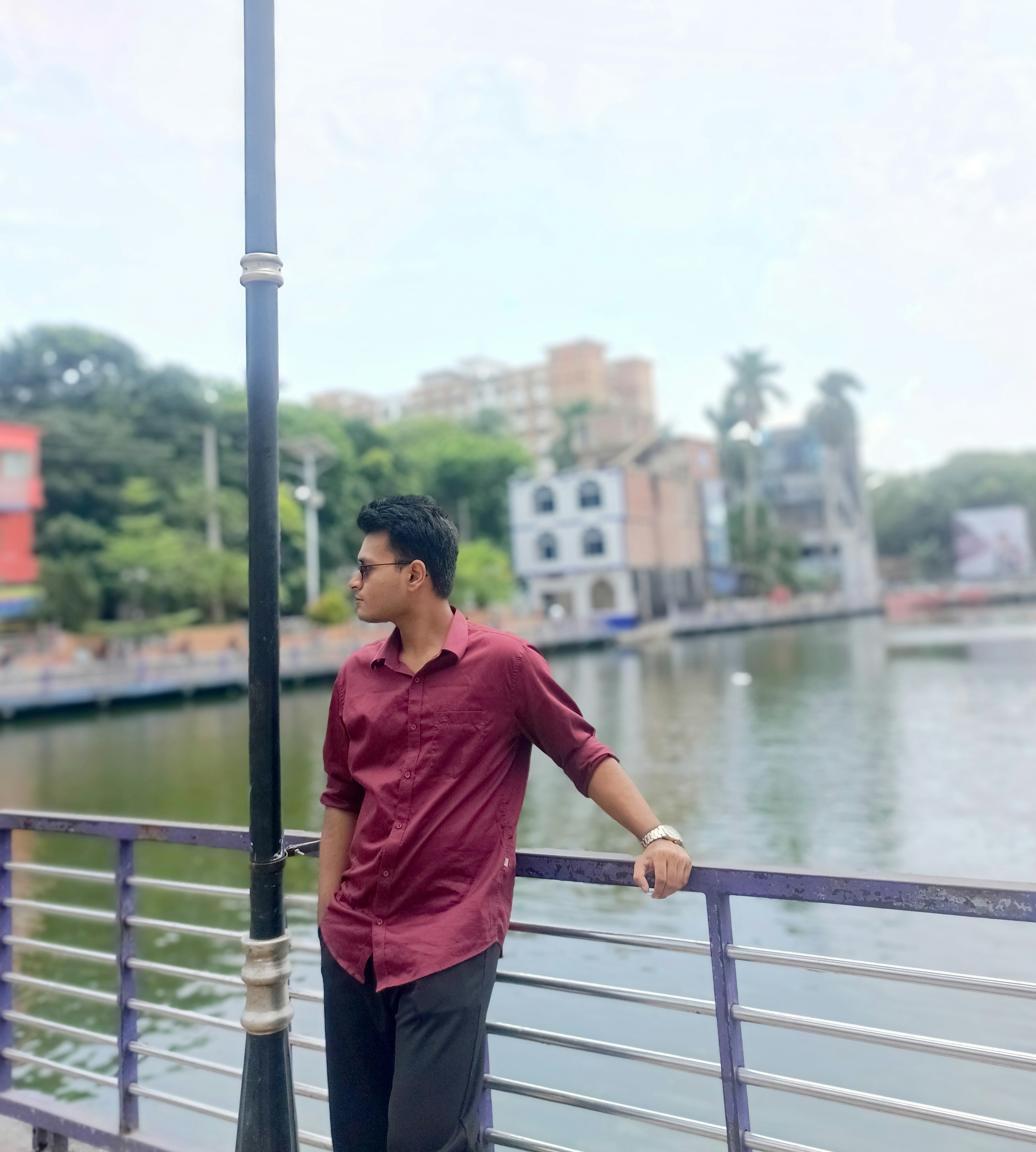 Portrait on the Pier: A Conversational Moment by the Riverfront