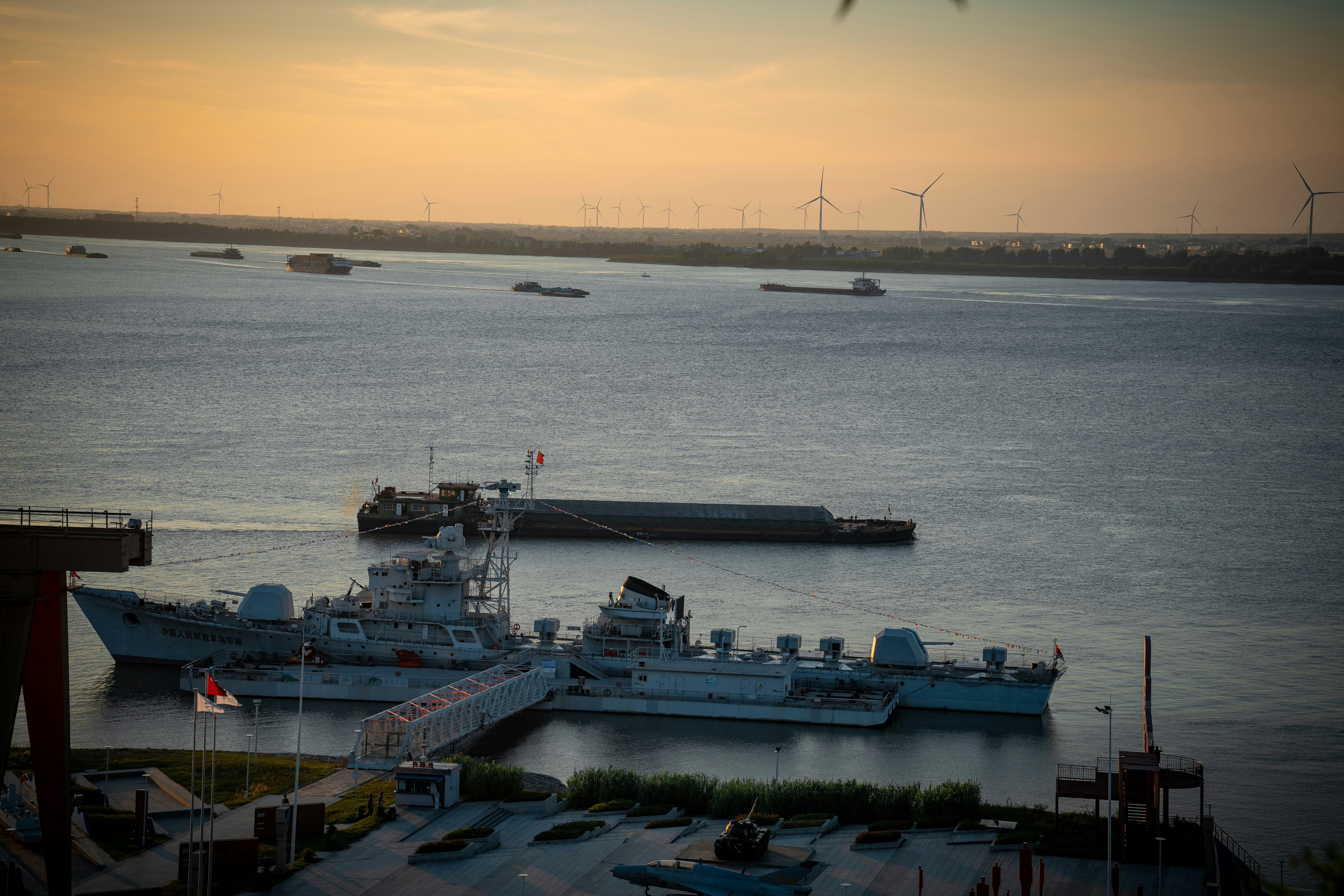 Quiet harbor of steel and wind: a marina at golden hour
