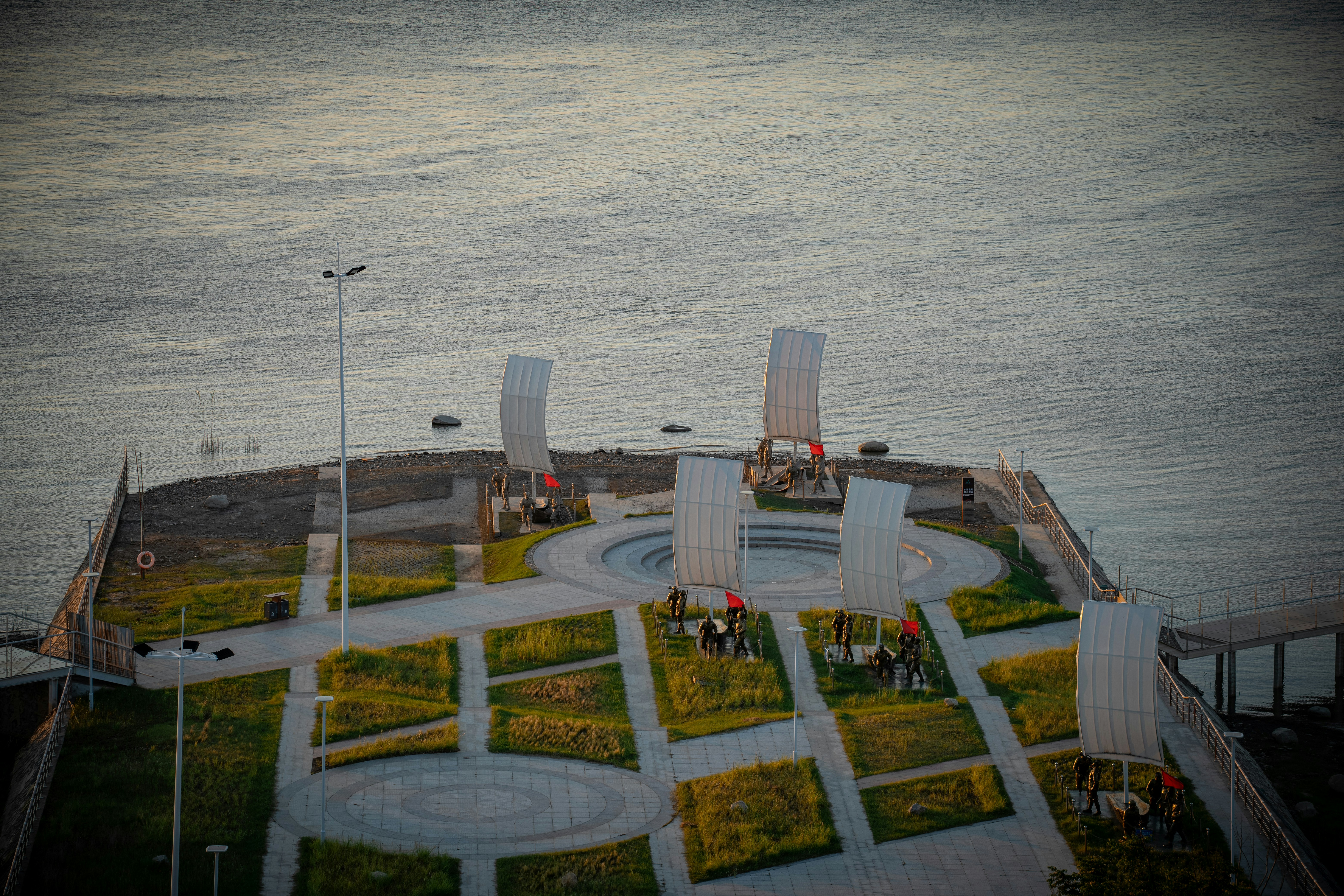 Aerial Terrace by the Sea: Sunlit Garden Above the Pier