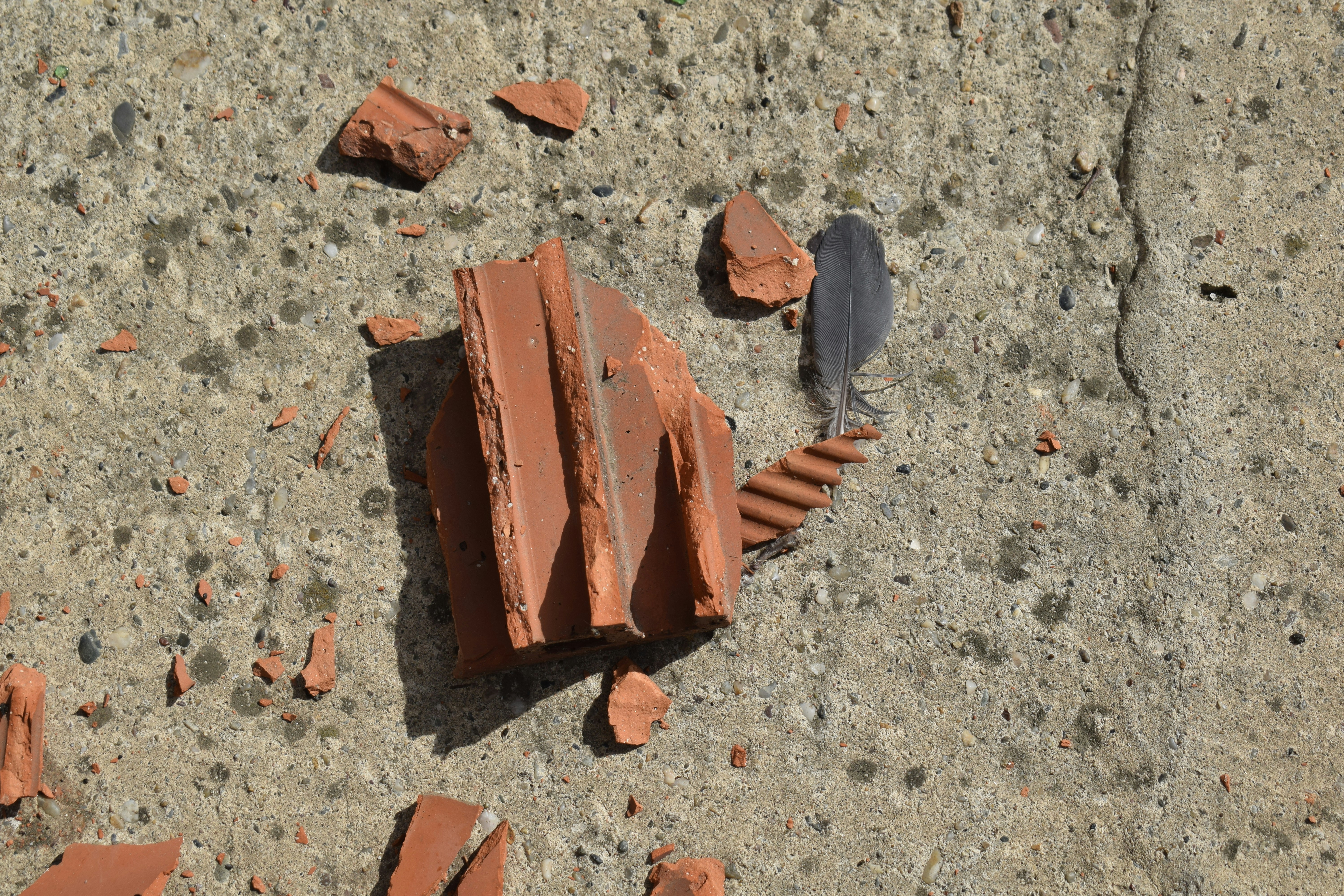 Crumbled Brick Fragment Scatter on Rough Concrete