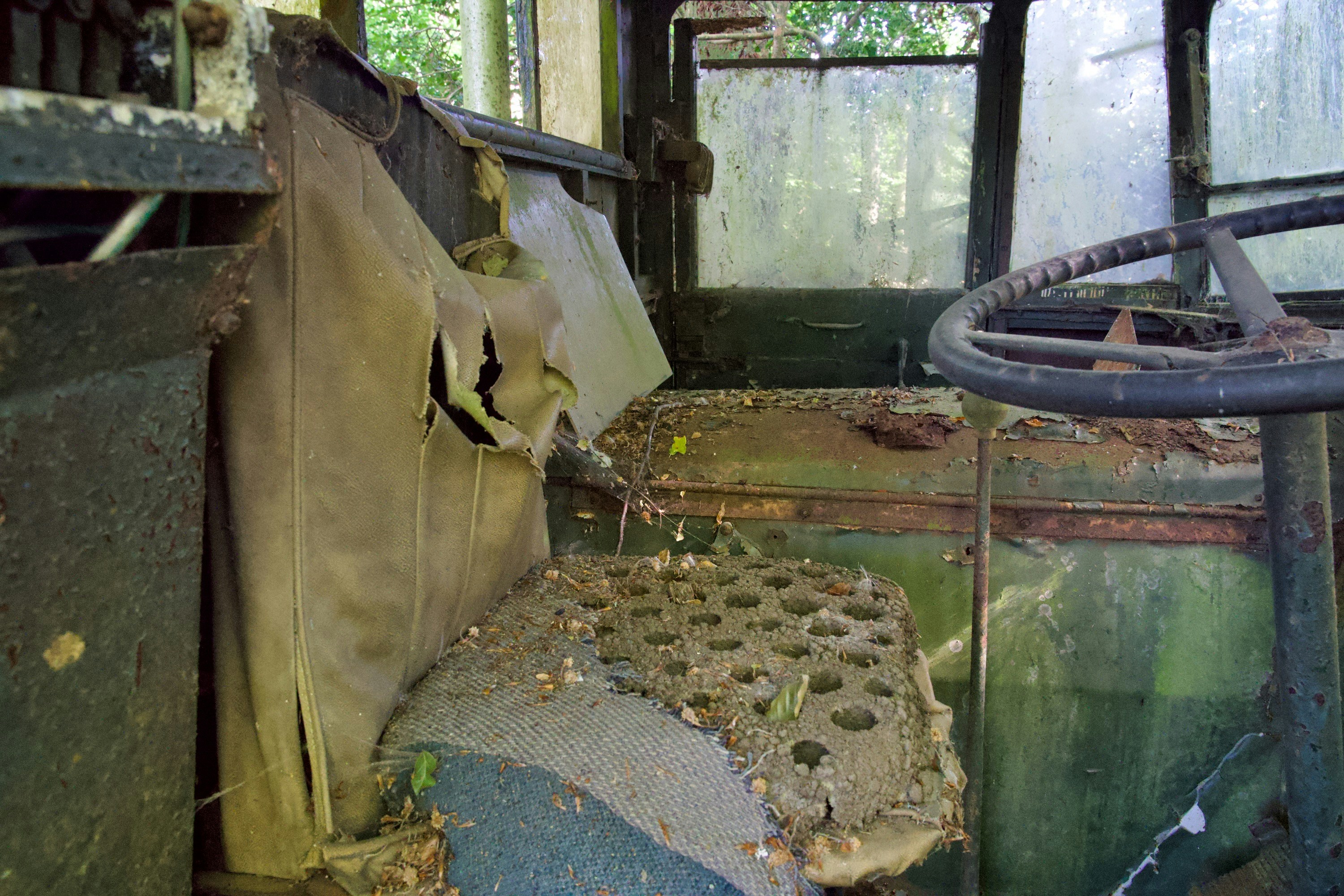 Irregular Cabin: A Rain-Silvered Interior of a Weathered Vehicle