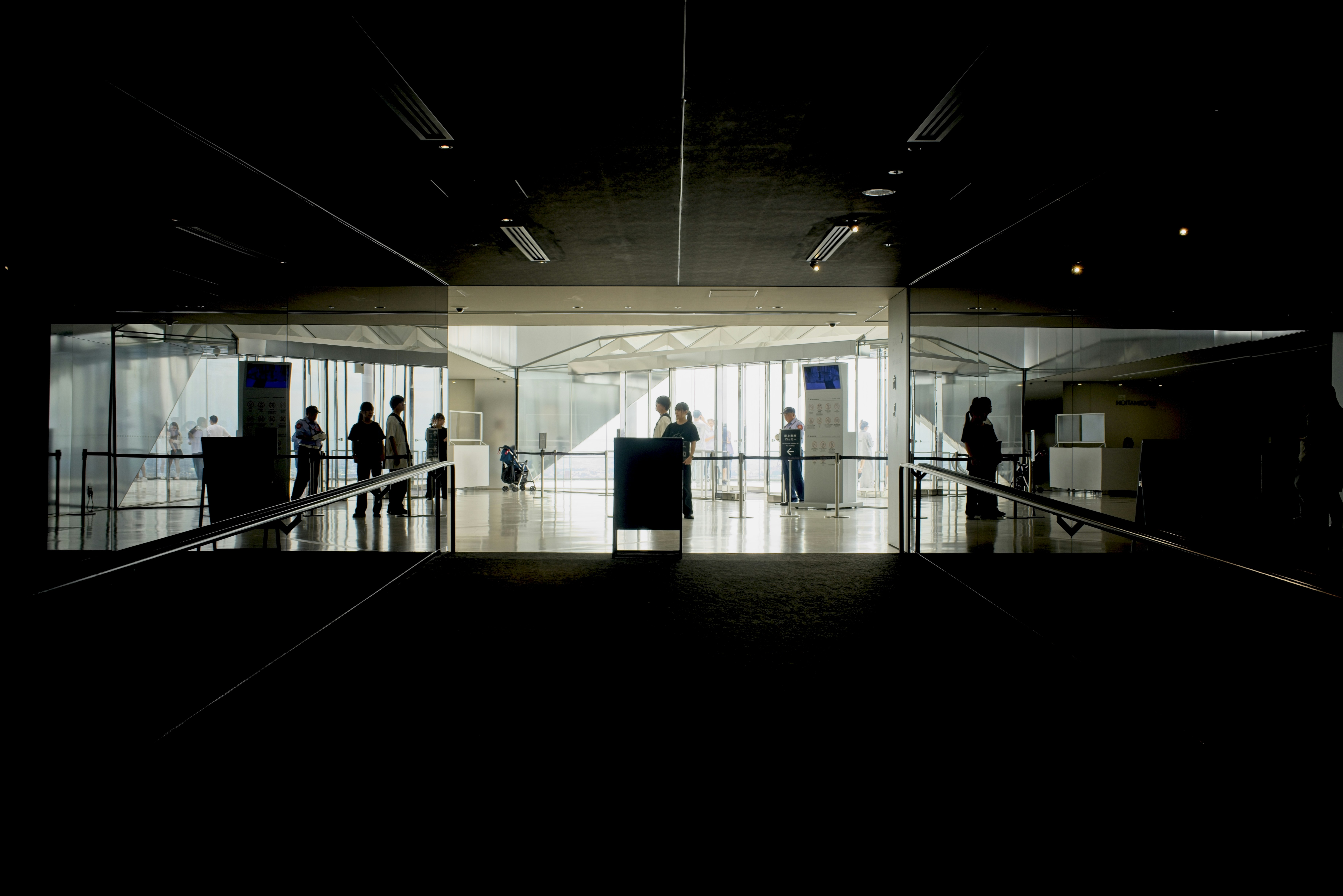 Liminal Lobby: Figures at the Threshold of Glass and Light