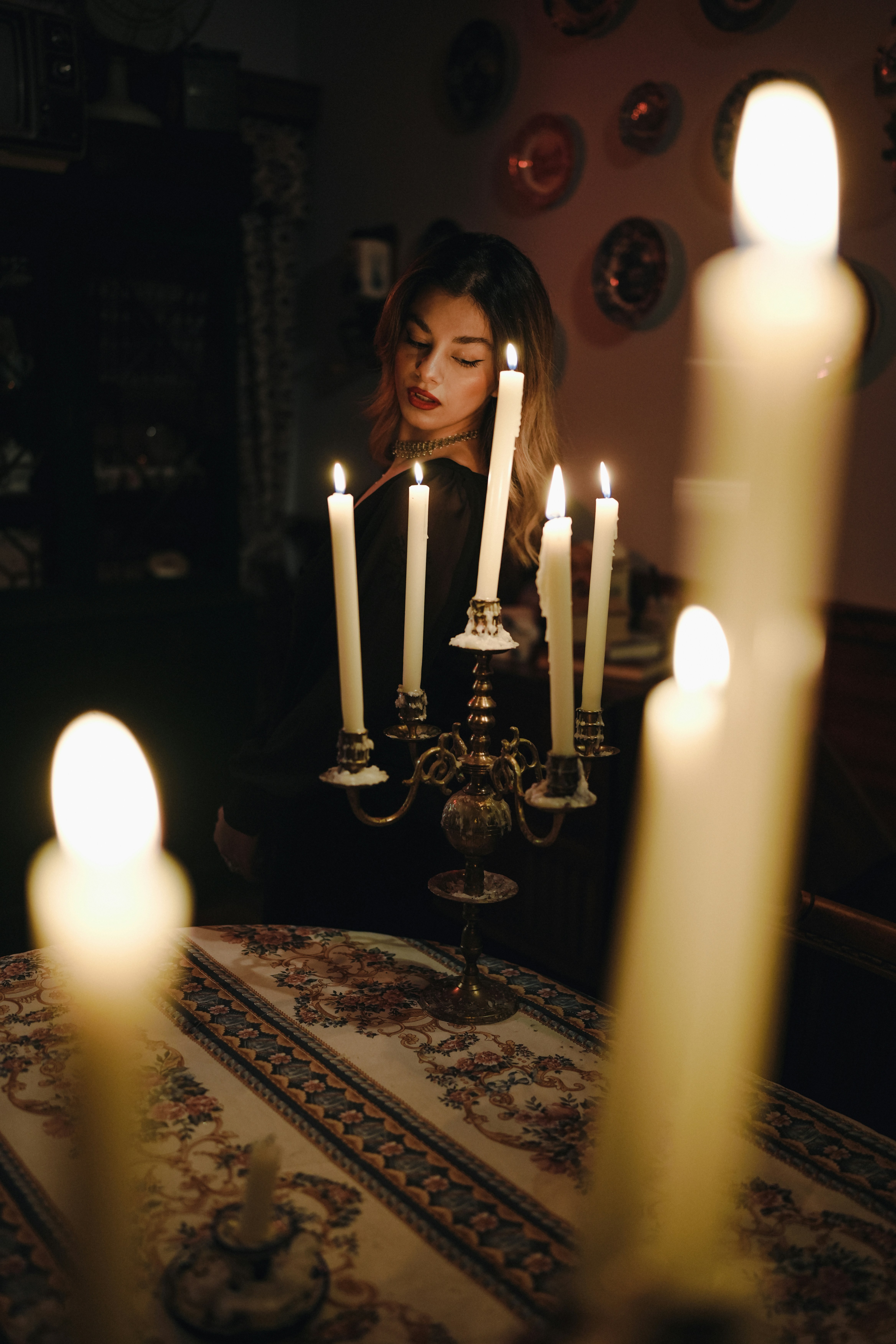 Candlelit Gaze: A Quiet Moment at the Table