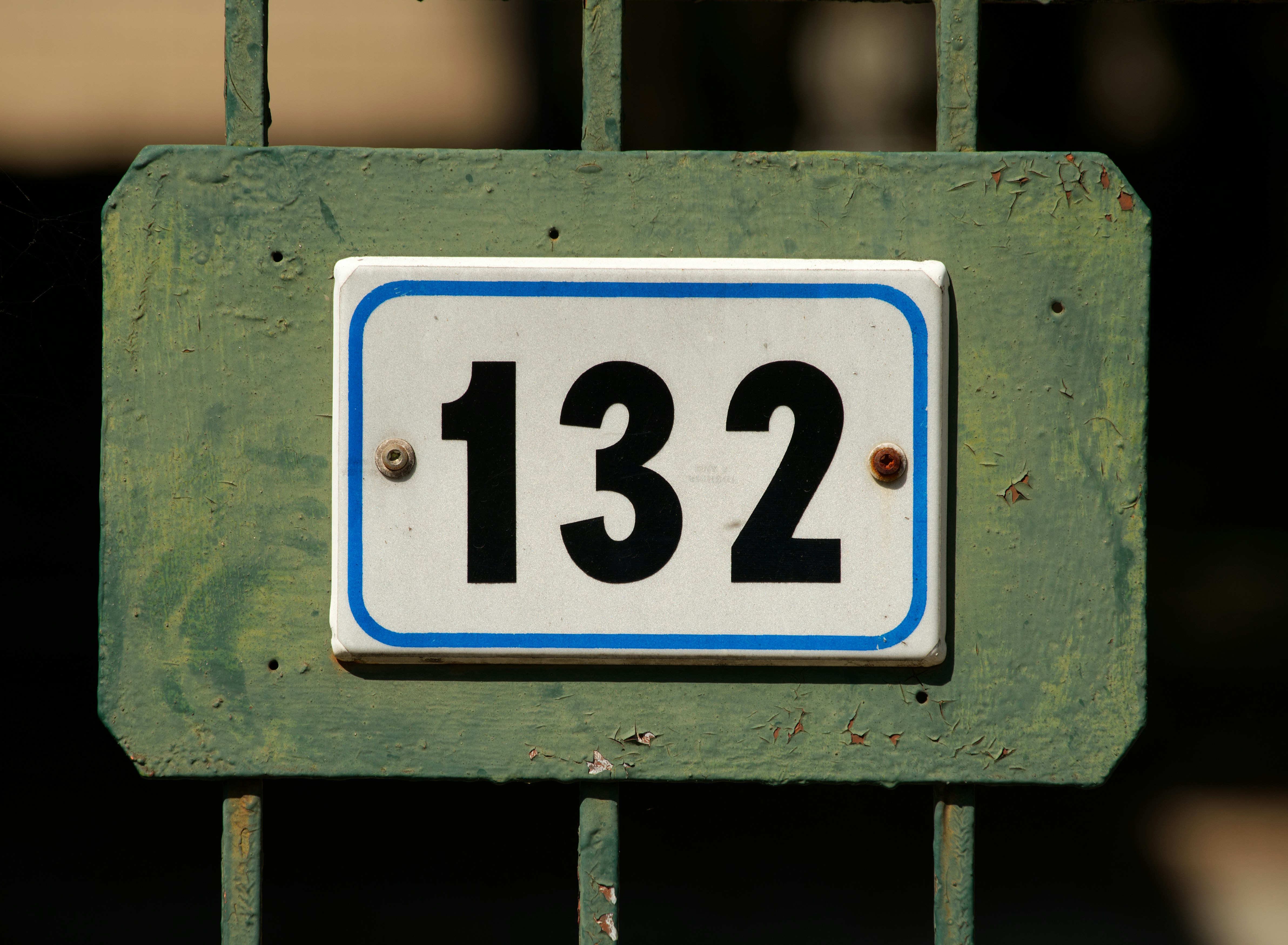 The Weathered Address Plate on a Vintage Gate