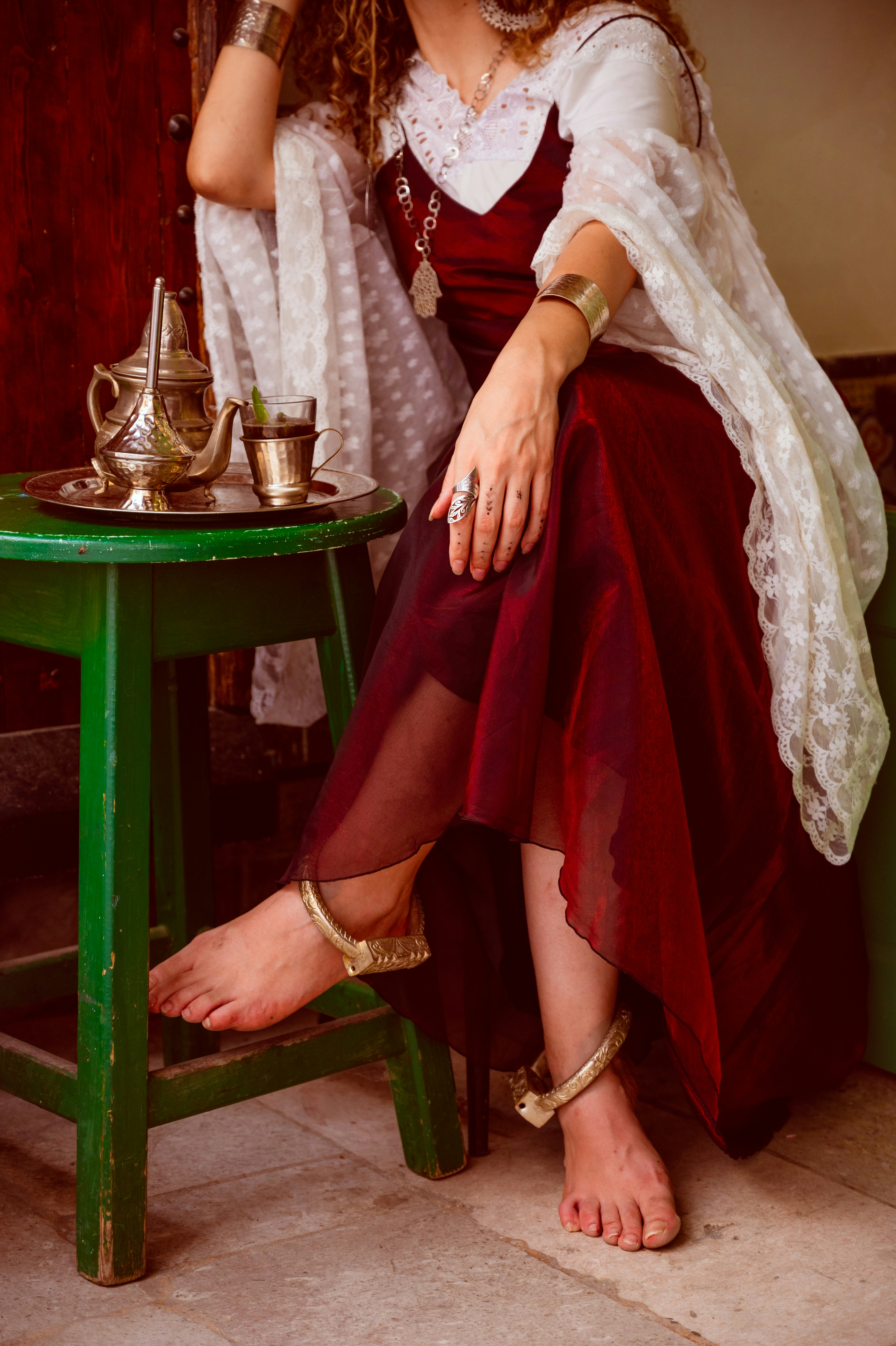 Graceful retreat: a dancer's poise by the green table