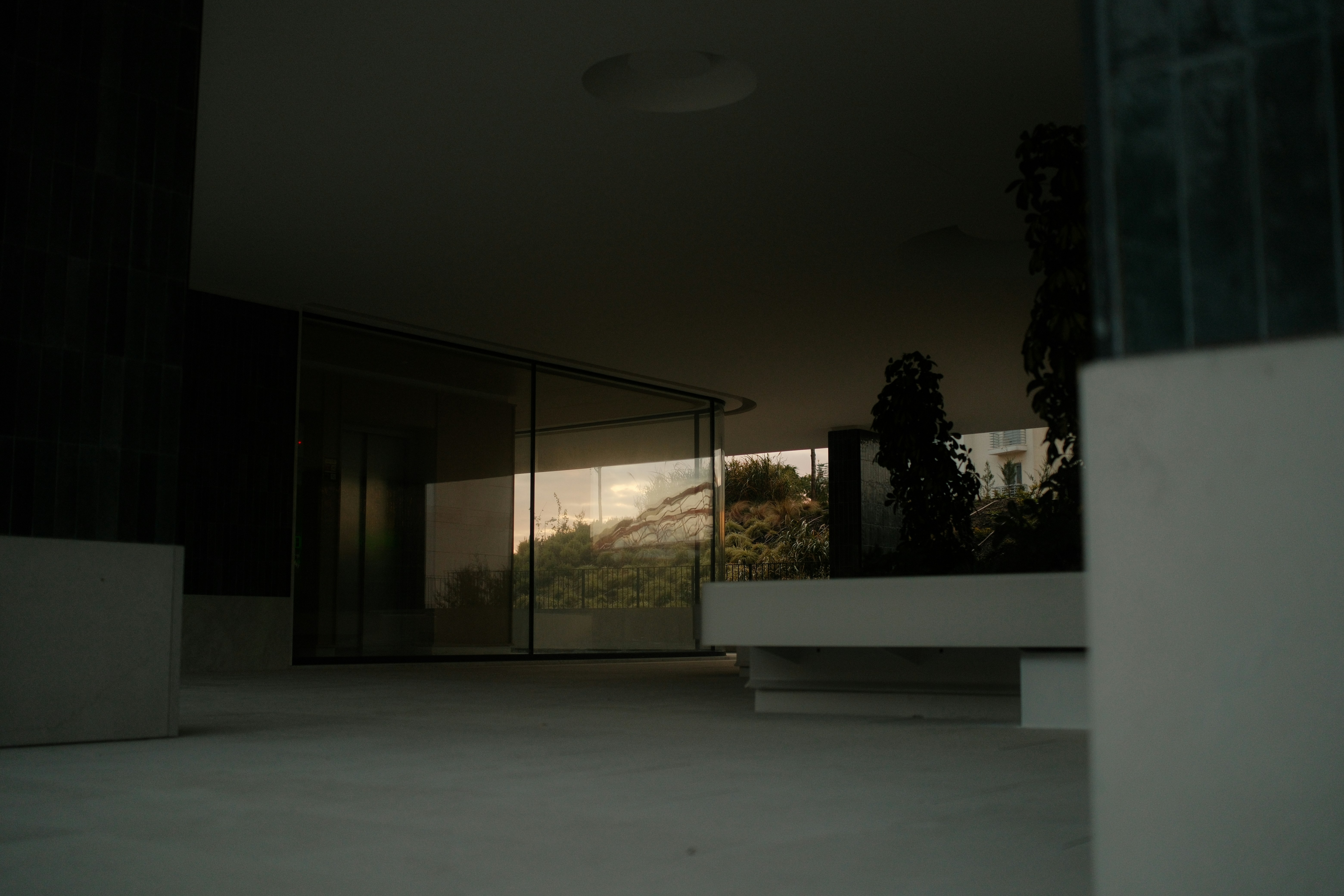 Shadowed Atrium at Dusk: Quiet Geometry and Glass Veil