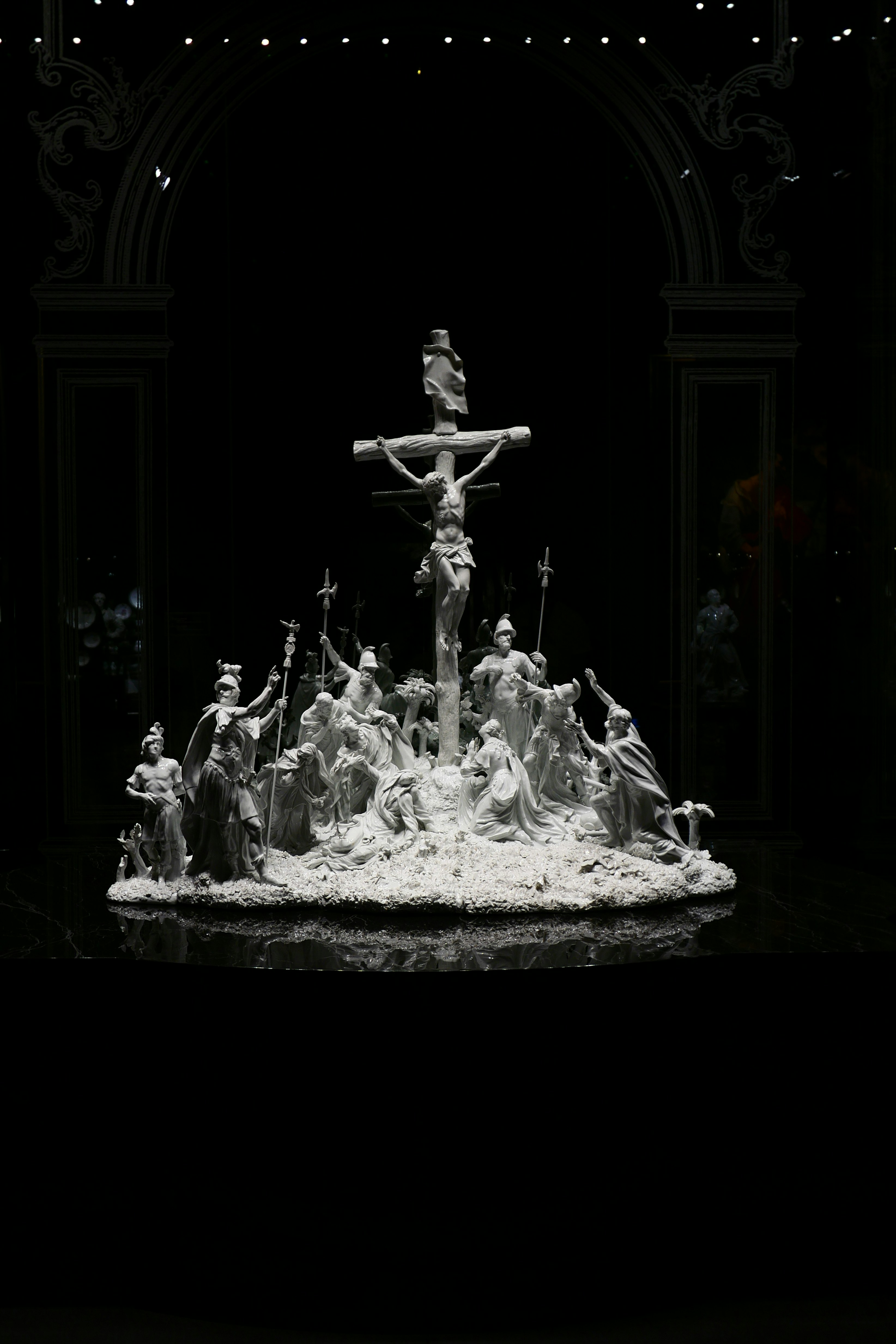 Cruciform Tableau: A Shrouded Chorus of Sculpted Figures