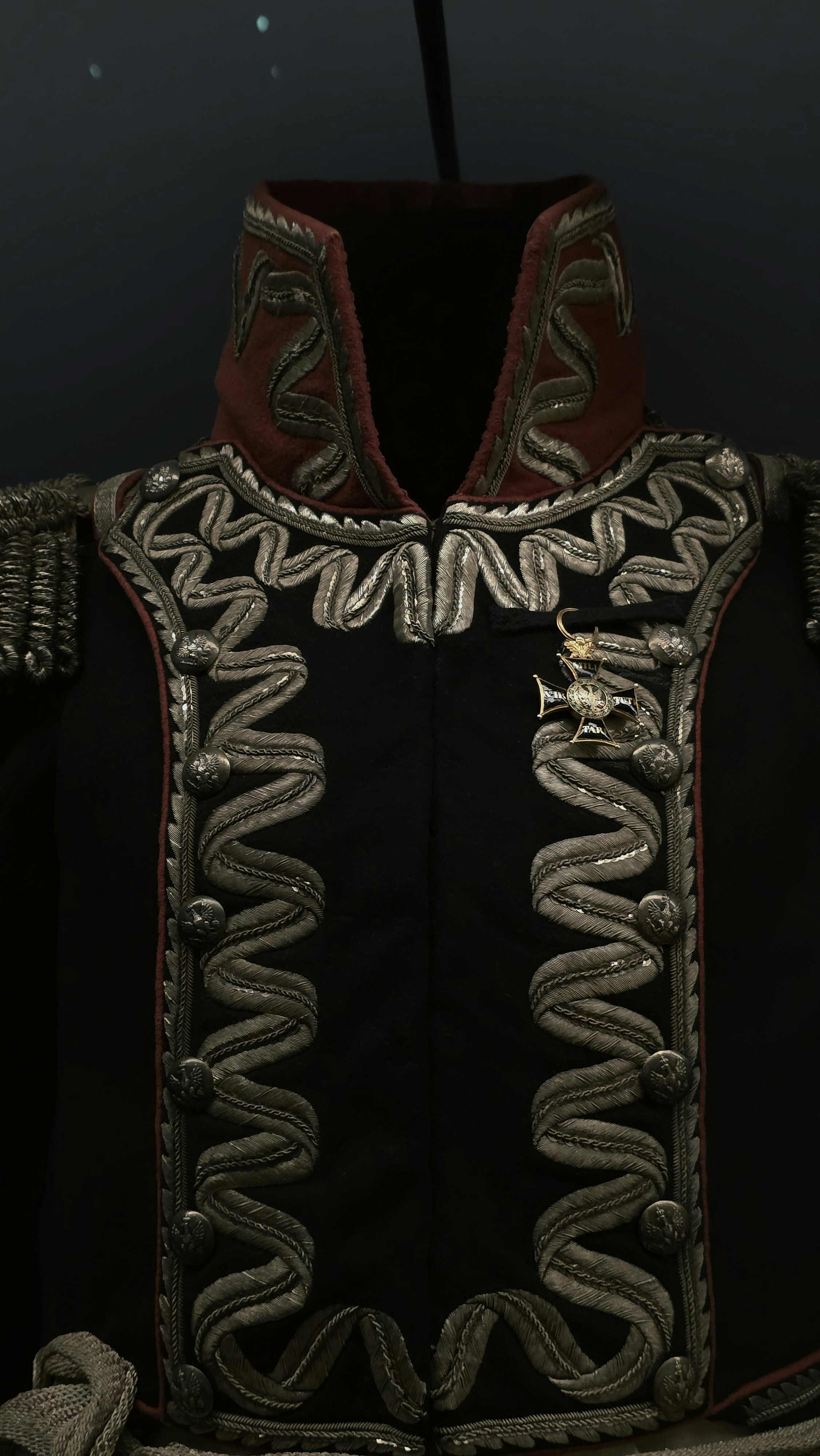 Embellished Military Jacket: Ornate Silver Braiding in a Dark Velvet Frame