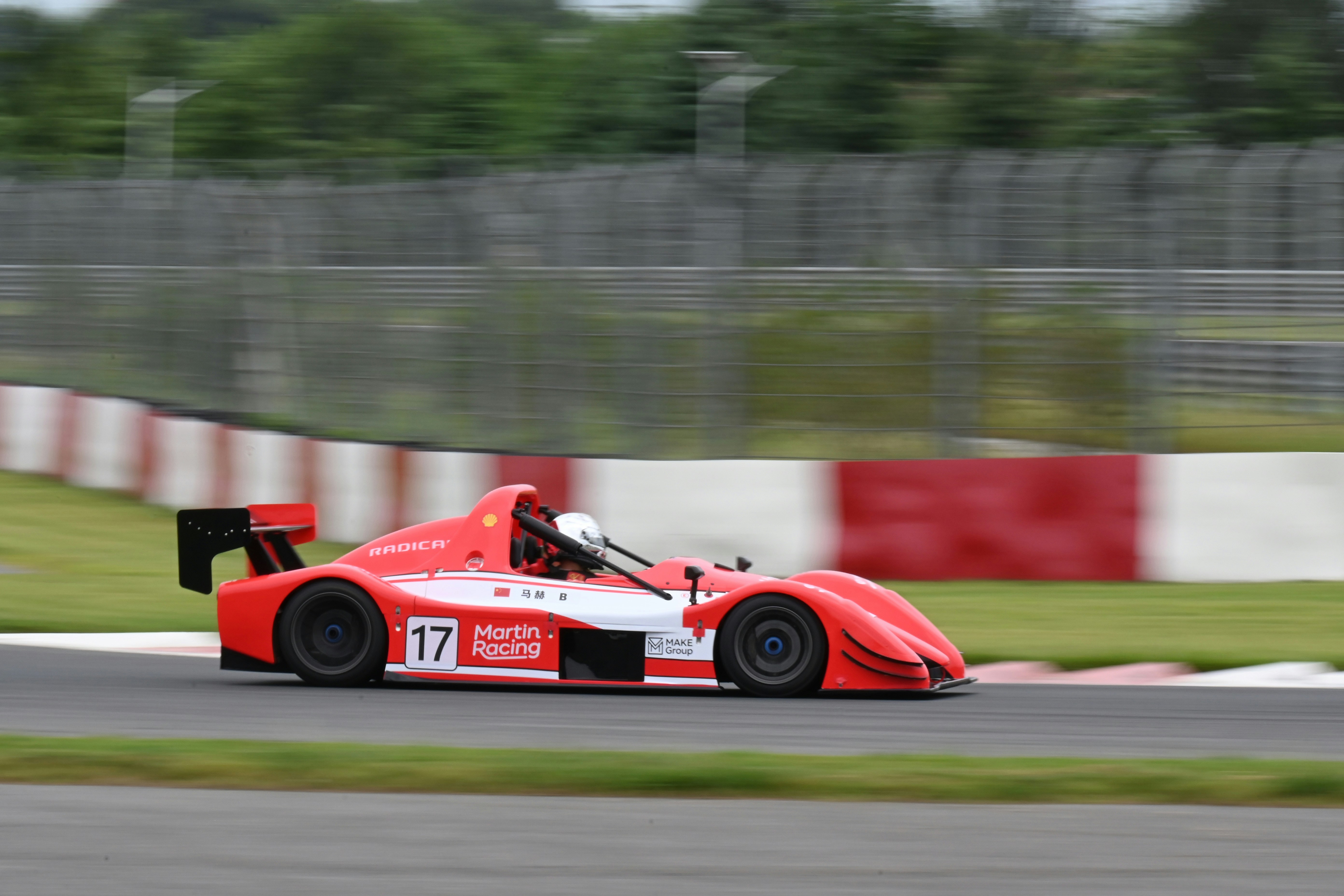 Red racer in motion: a sprint toward the apex