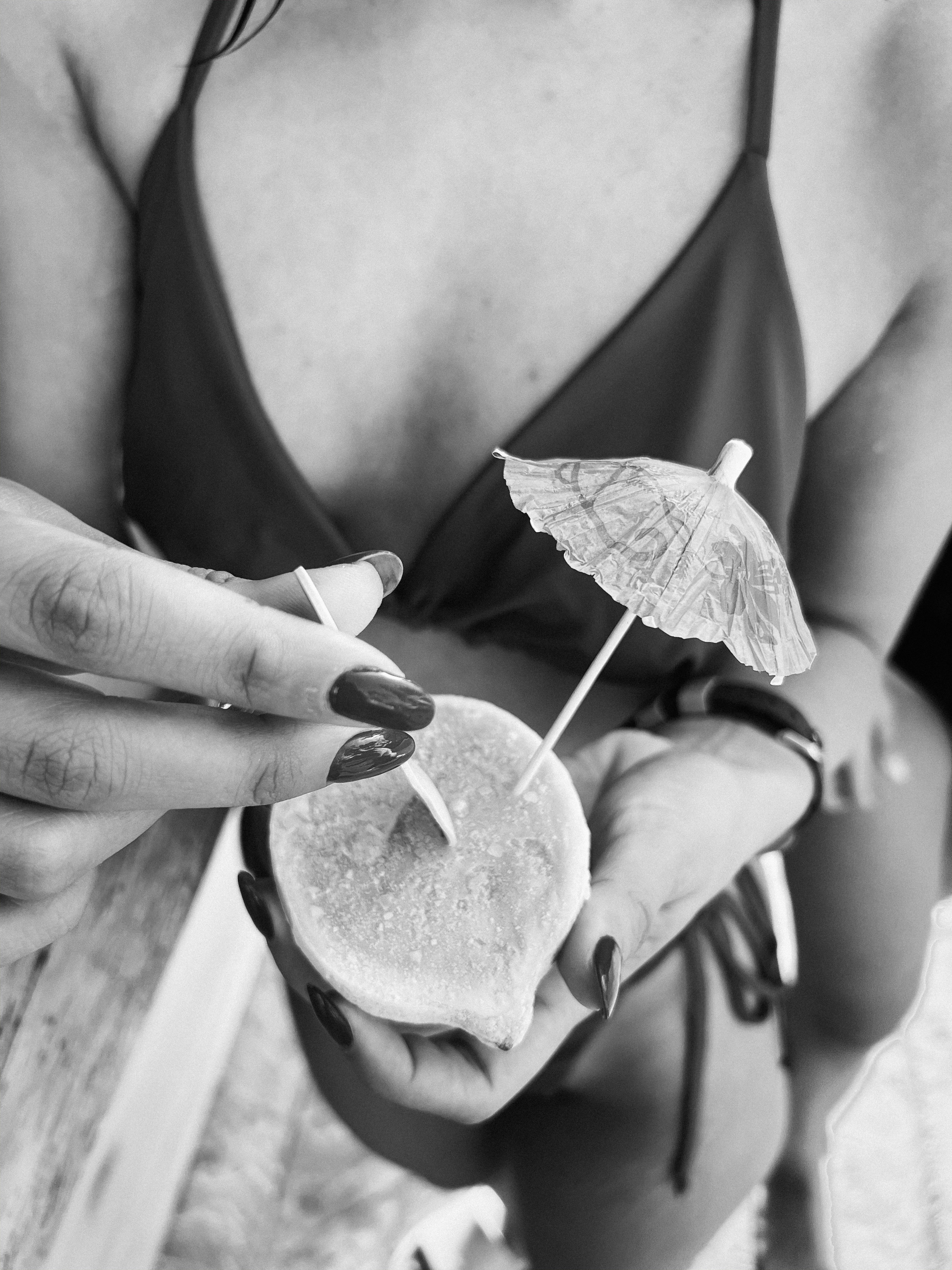 Sunkissed citrus: a tropical cocktail held aloft with a parasol