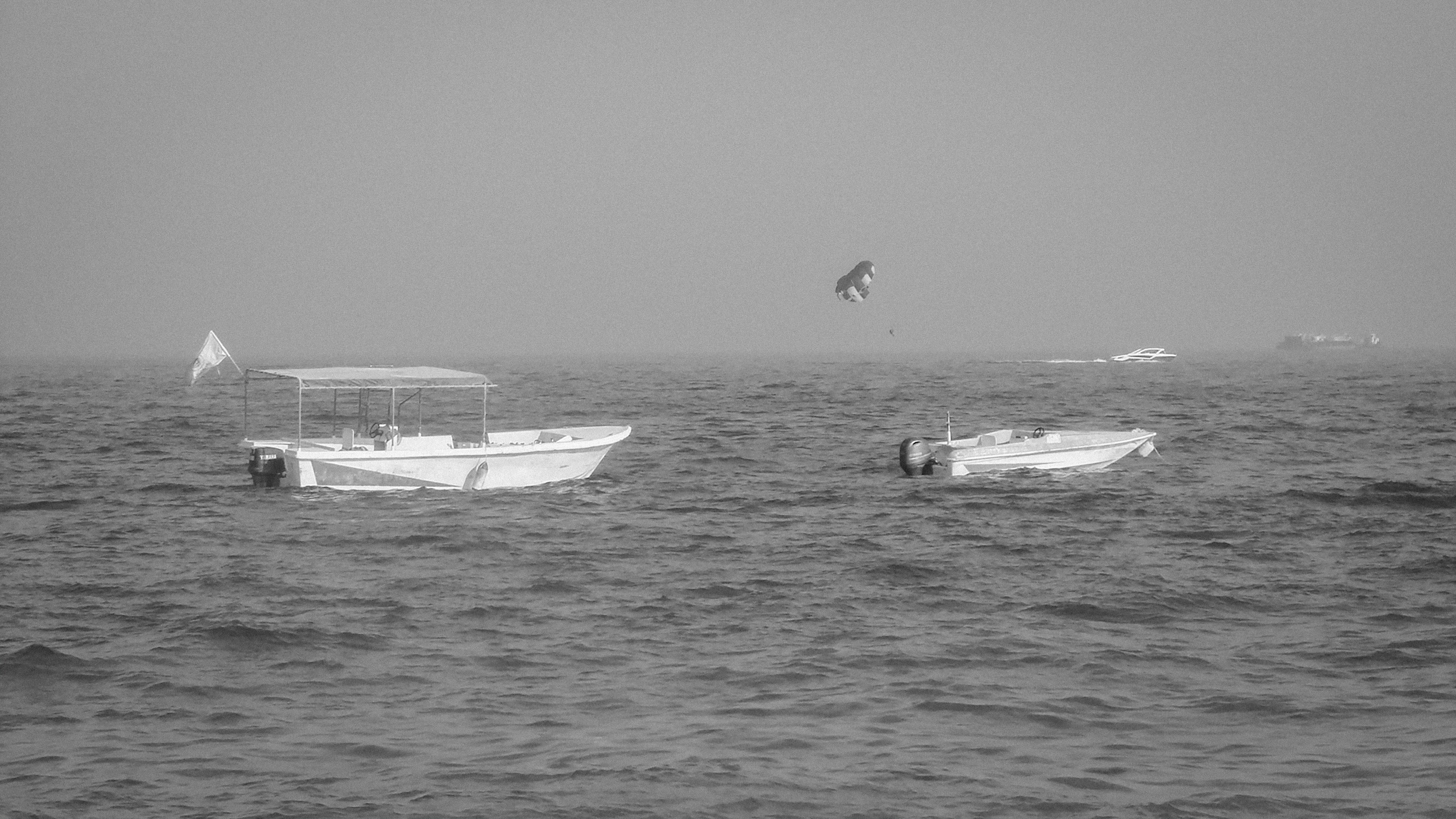 Two Boats on a Calm Sea at Dusk