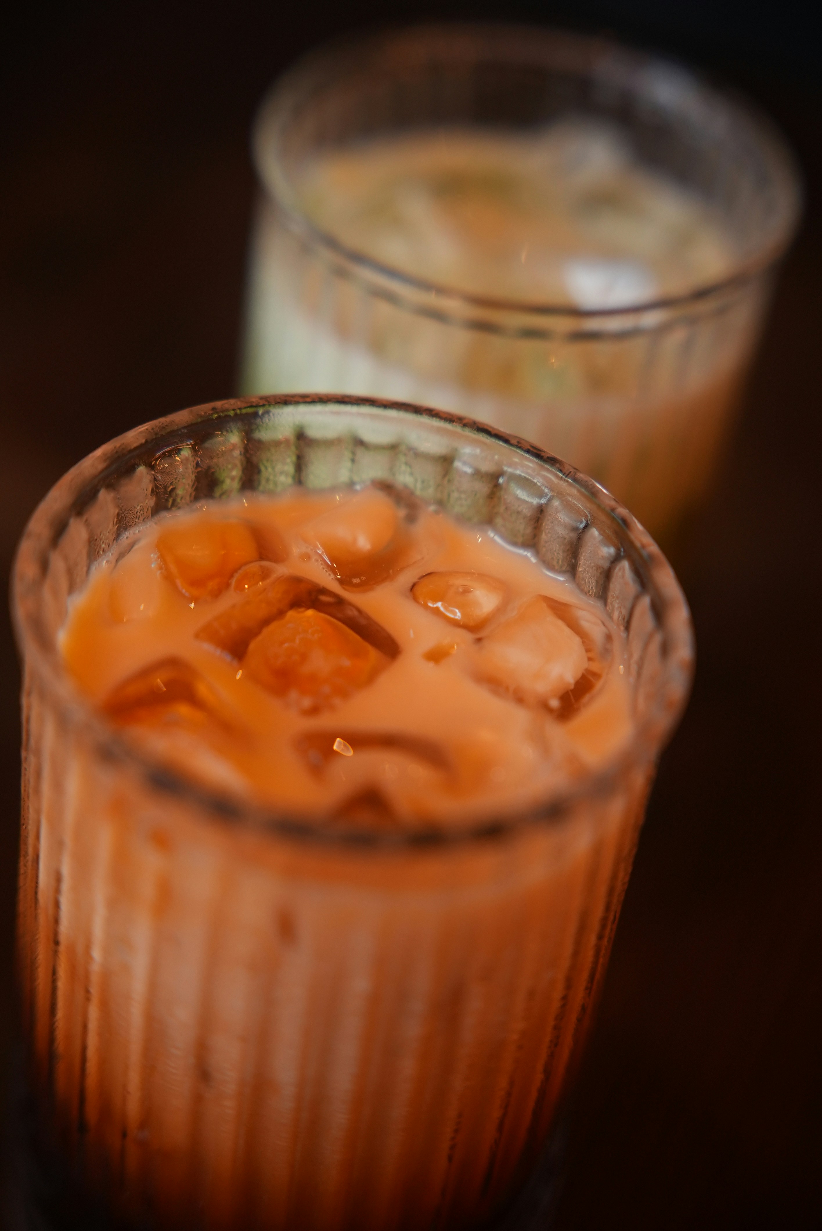 Ice-crowned Amber: Close-up of a Frosted Glass Sip