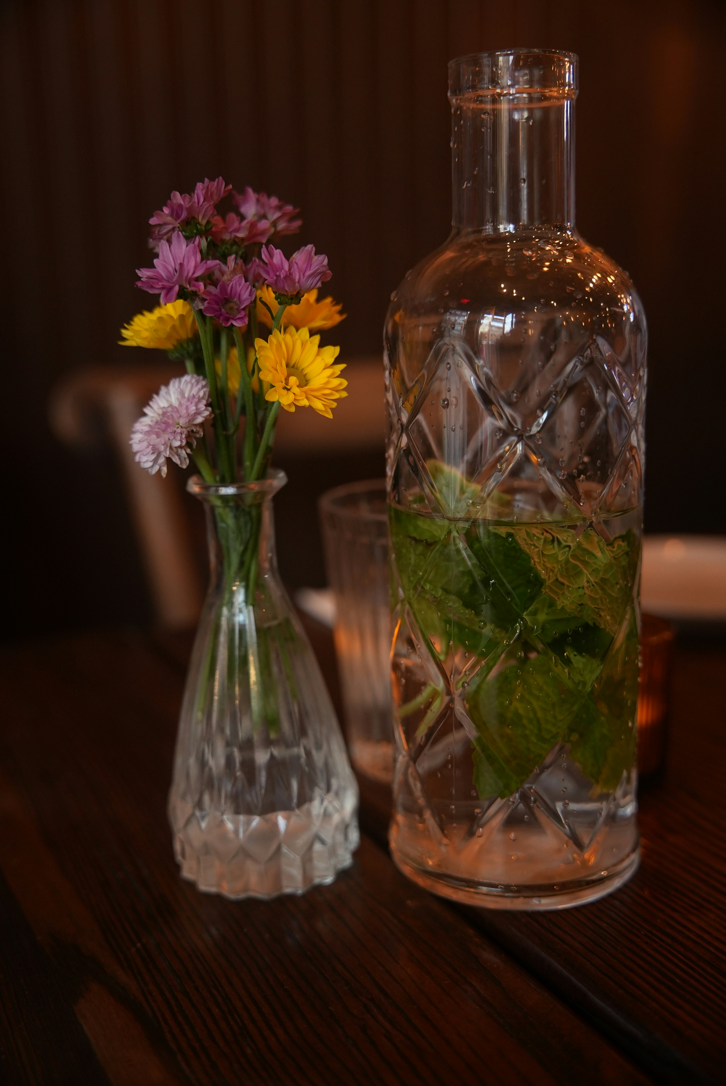 A Glassy Moment: Minty Glow Beside a Floral Vessel