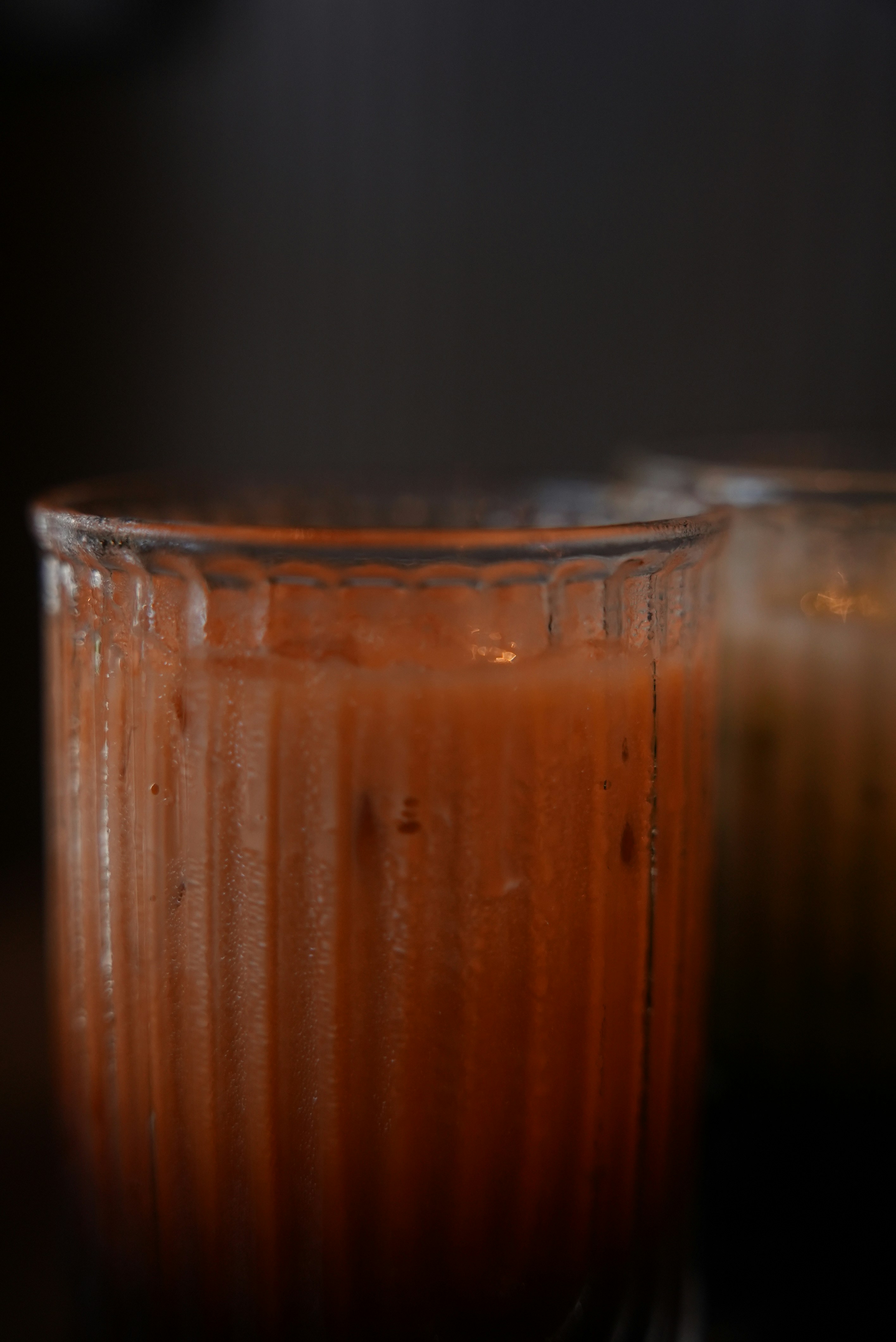Amber Mist: Close-Up of a Drink Glass with Soft Backdrop
