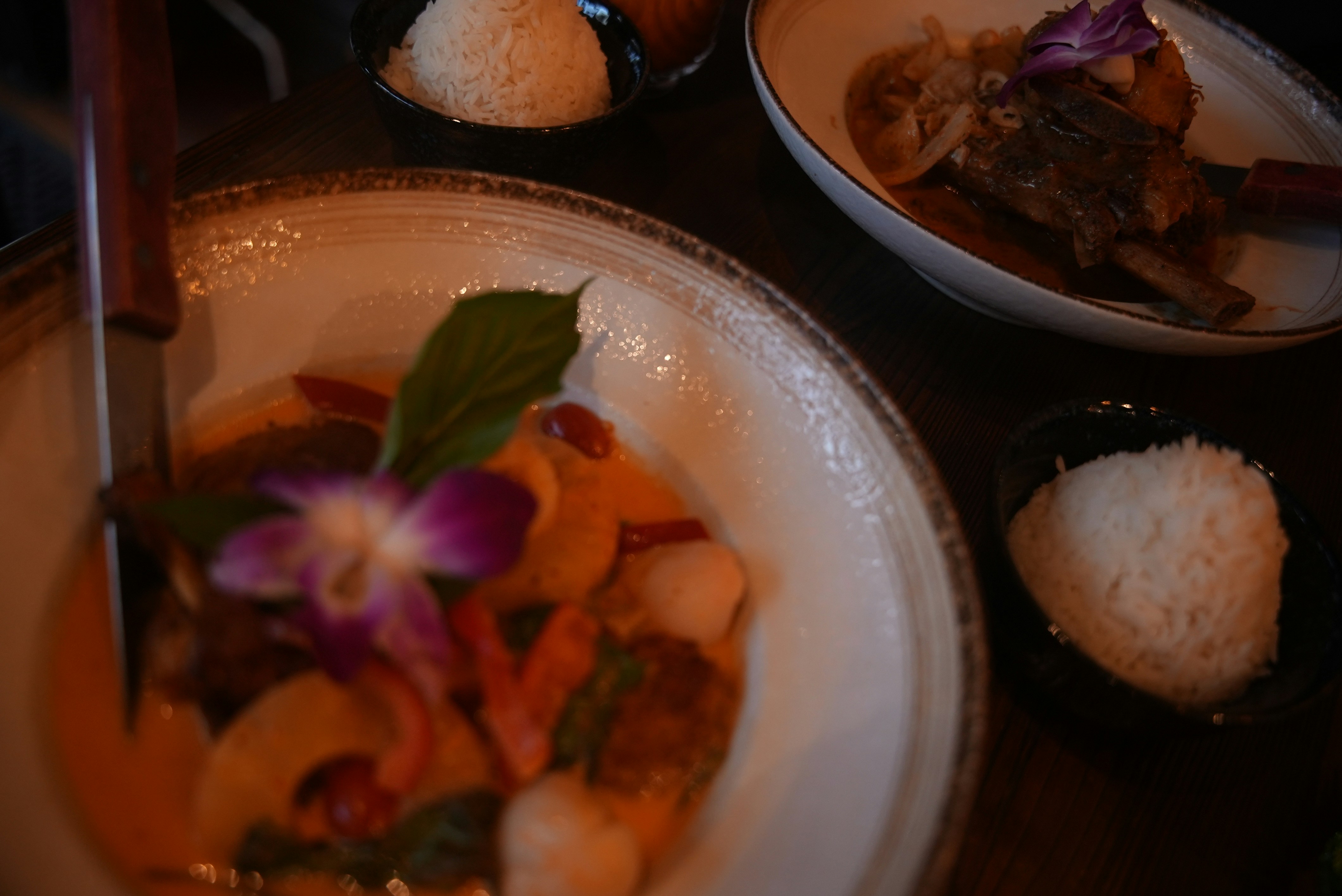 Floral Garnish over a Shaded Bowl: An Intimate Dinner Moment
