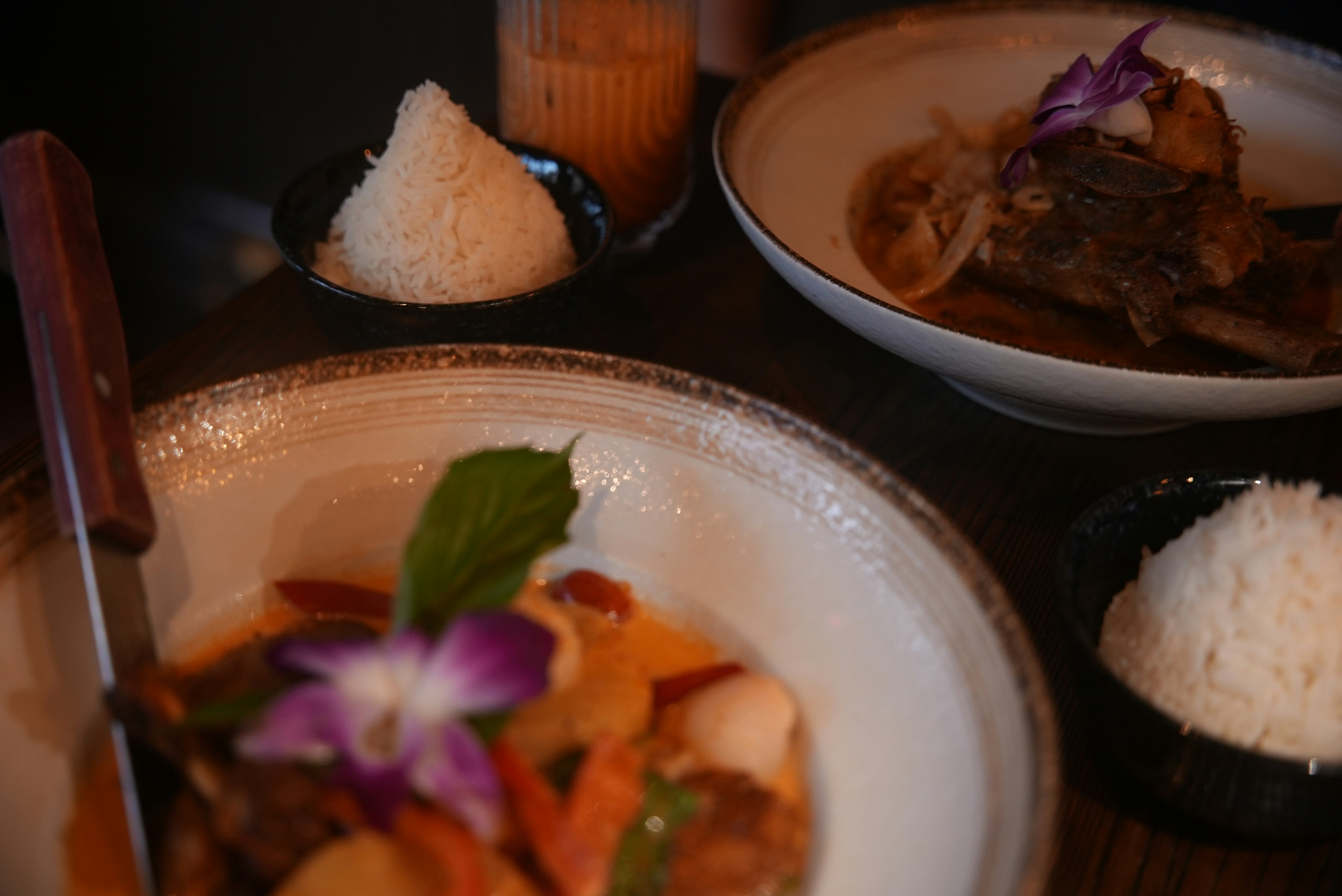 Floral Garnish Crowned Bowl of Aromatic Stew