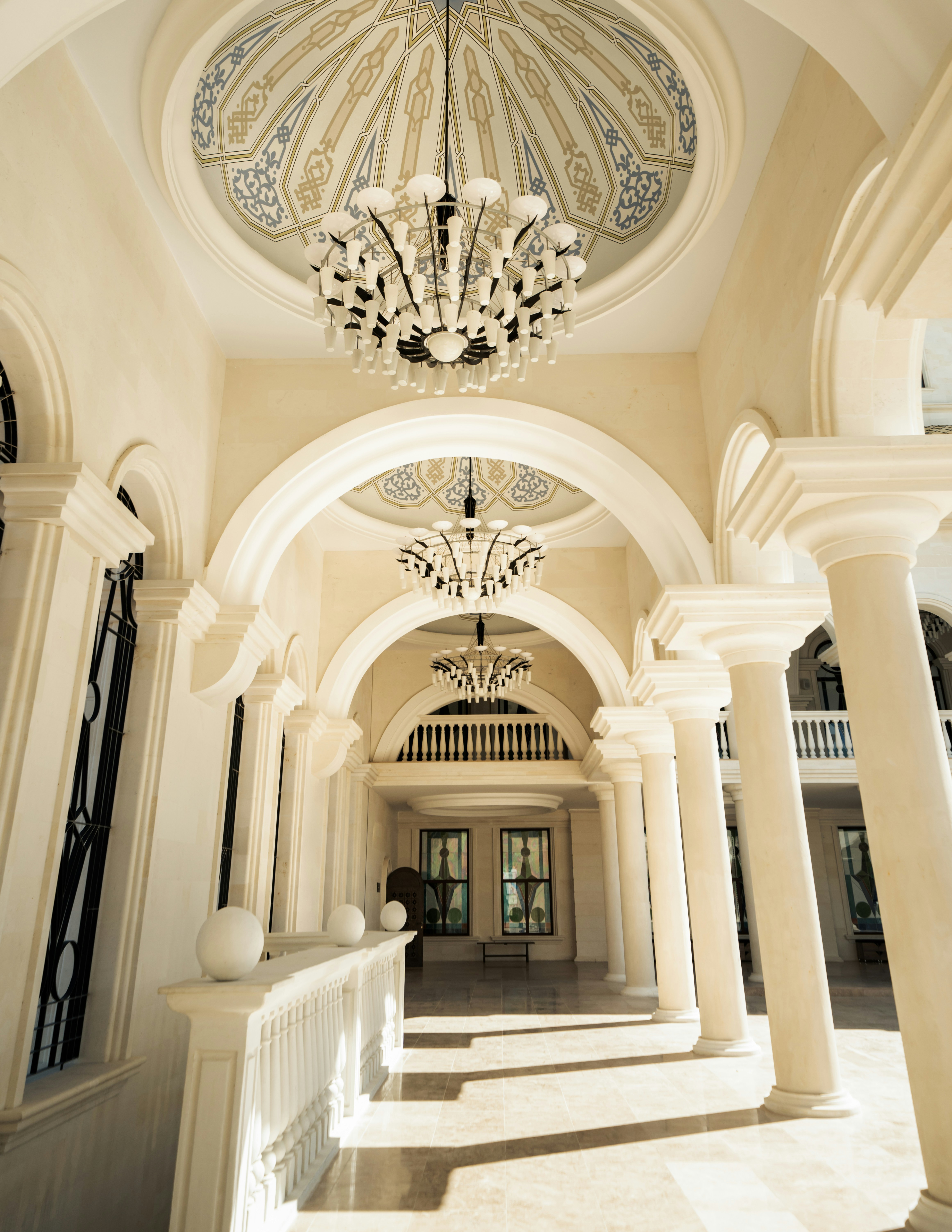 Echoes of Light: A Grand Corridor of Arches and Chandeliers