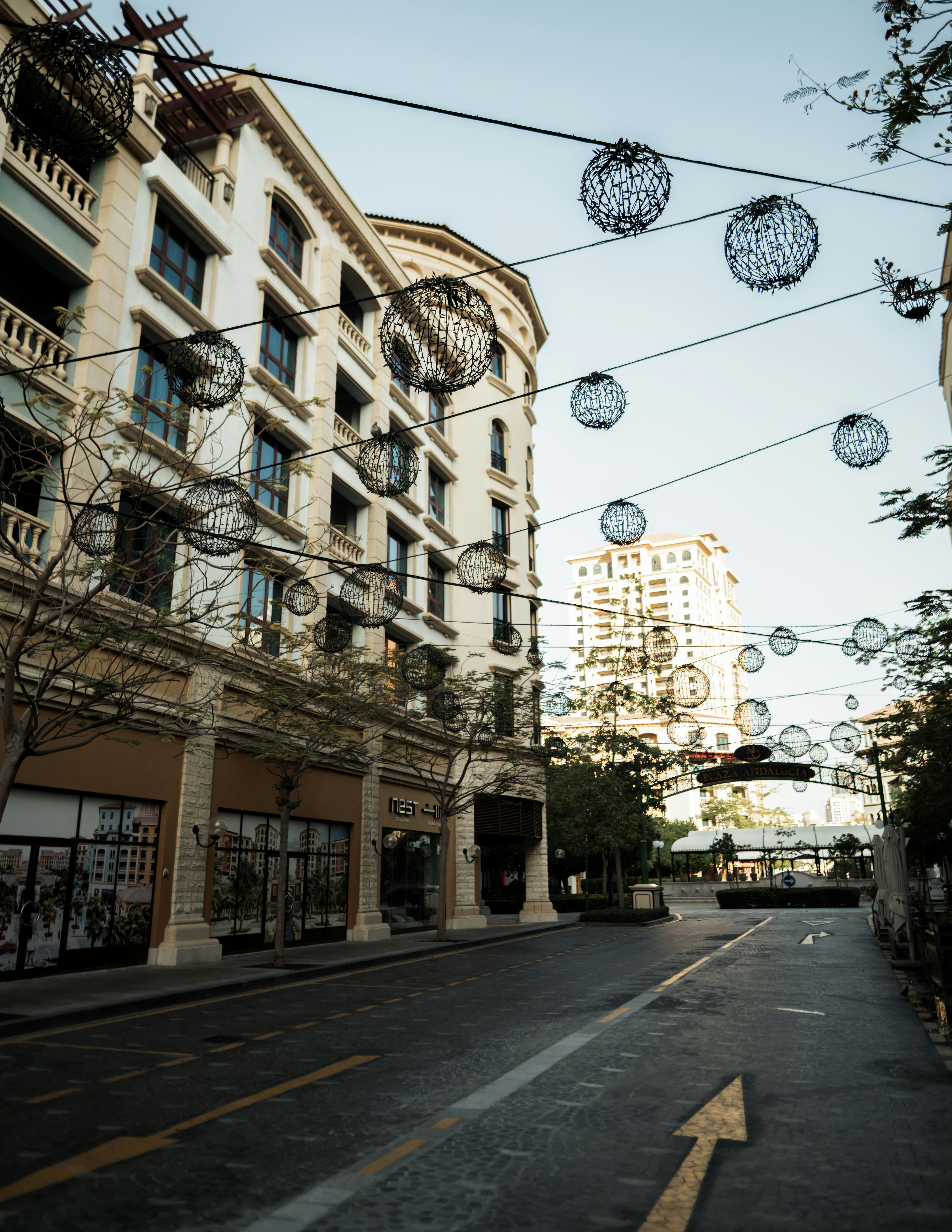 Lanterns Over a Quiet Urban Avenue