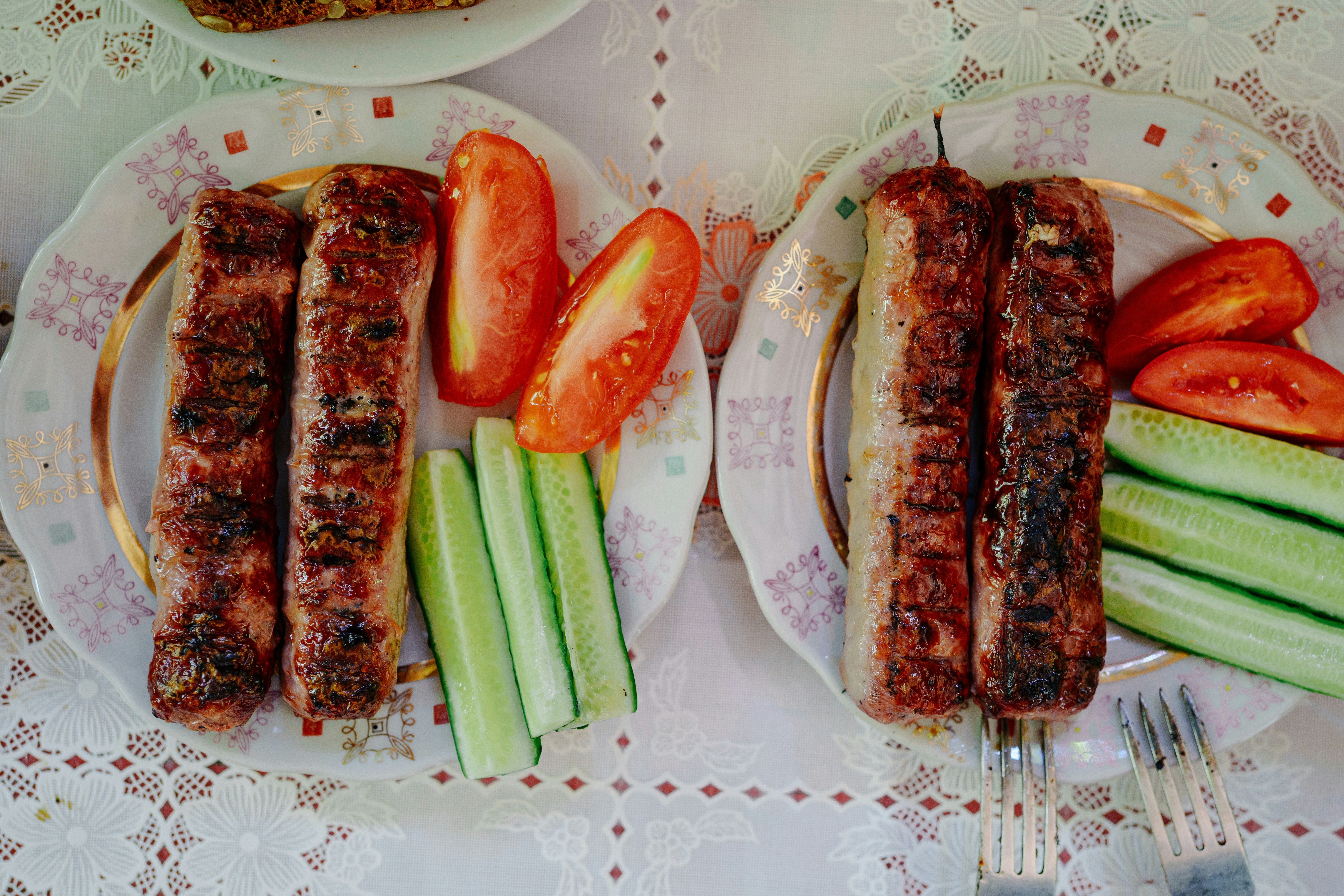 Charred Skewers and Fresh Veggies on a Floral Table