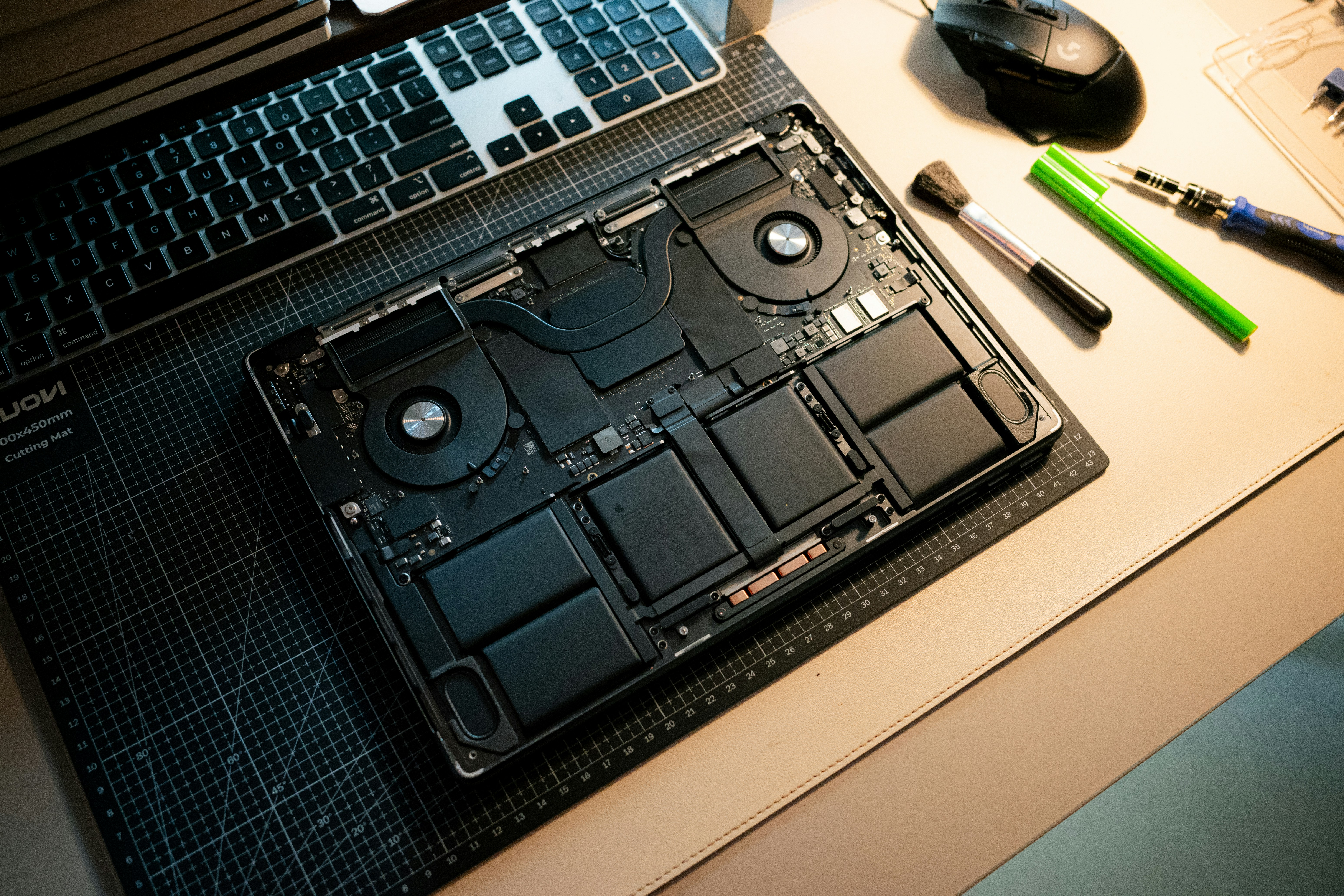 Disassembled Laptop: Exposed internals on a workbench